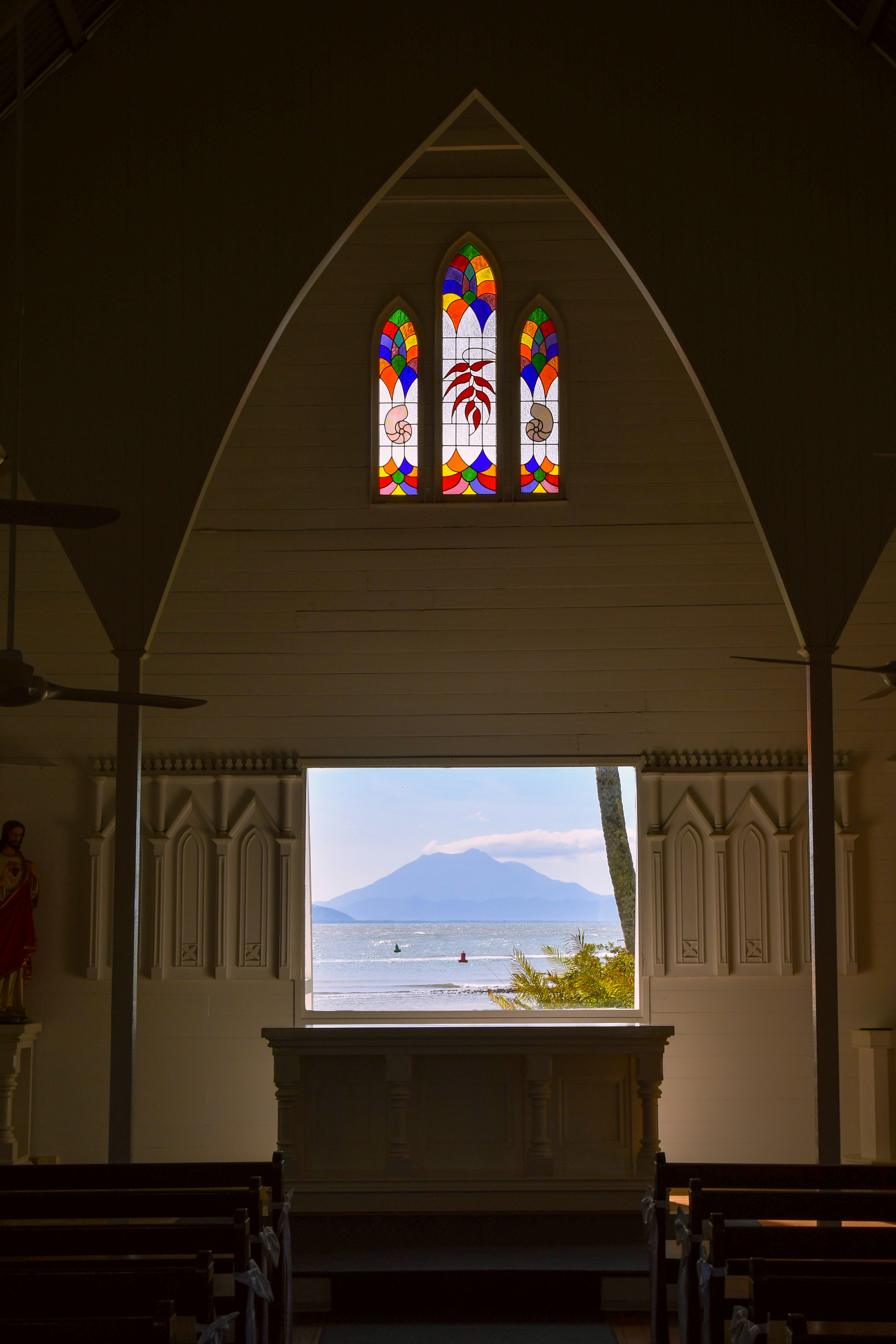 Stained Window Glow Over Altar: Light Through the Chapel Vista