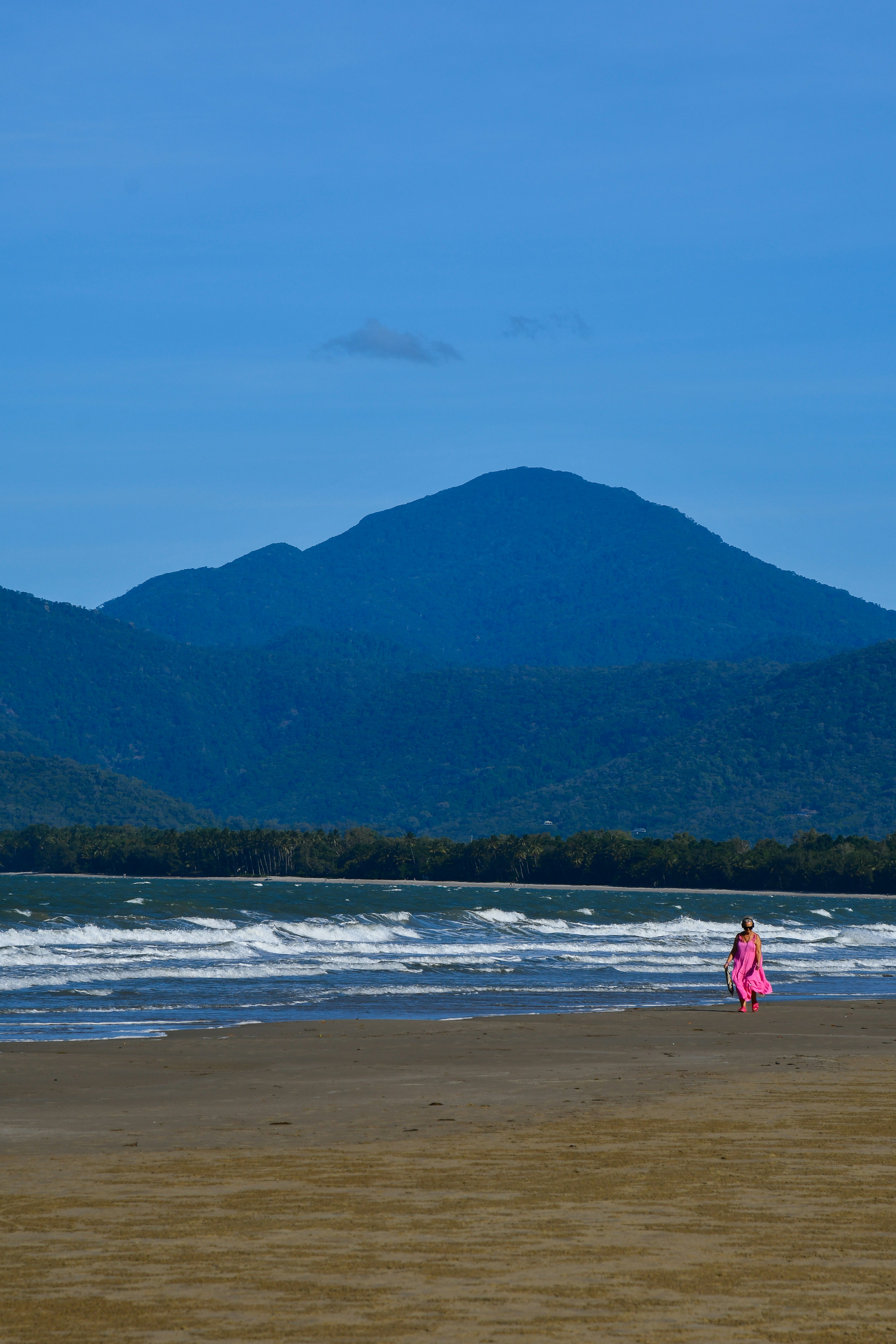 Lonely Beachwalk Beneath a Blue Mountain Sky