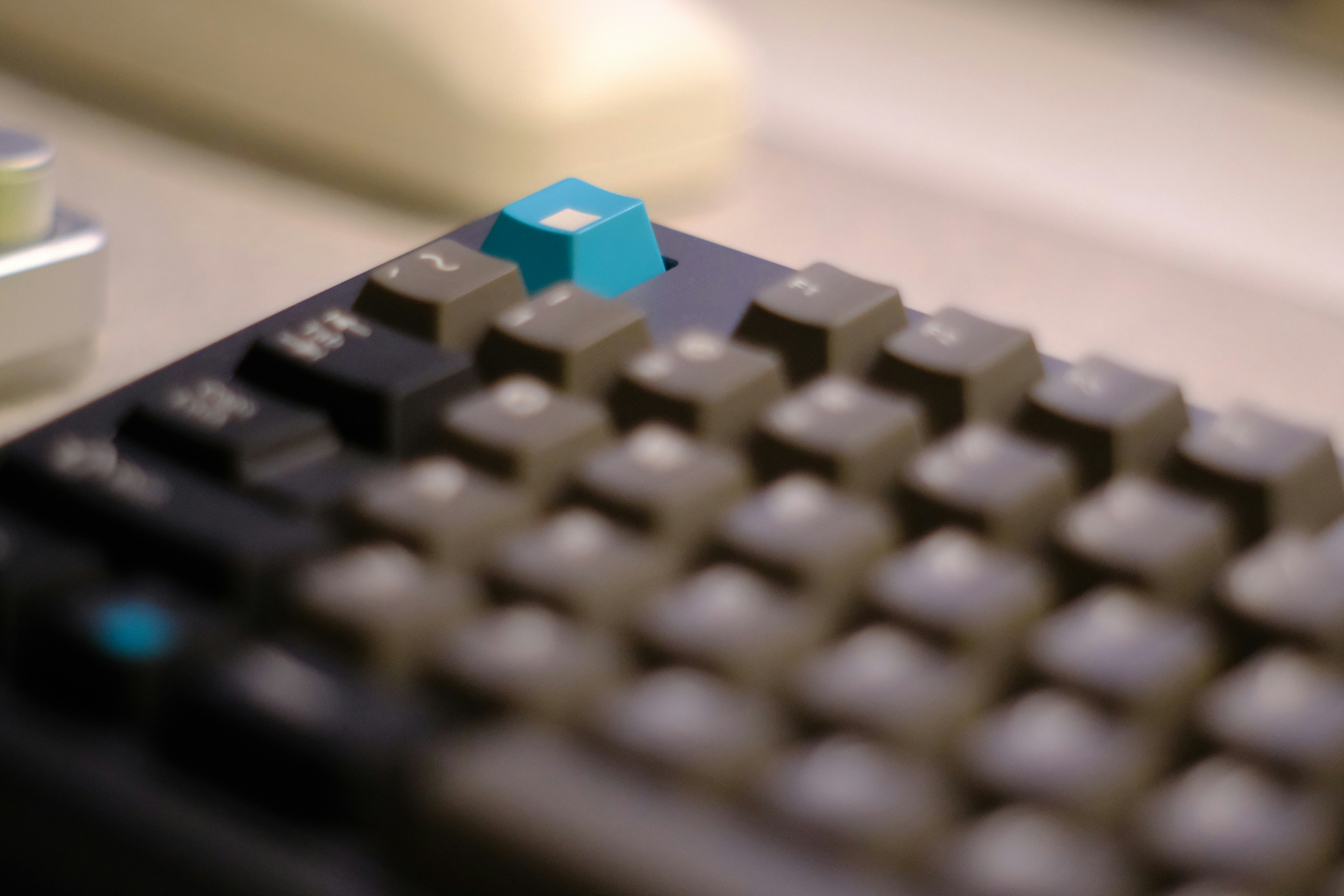 Blue-Top Key Quietly Pops Against a Sea of Gray