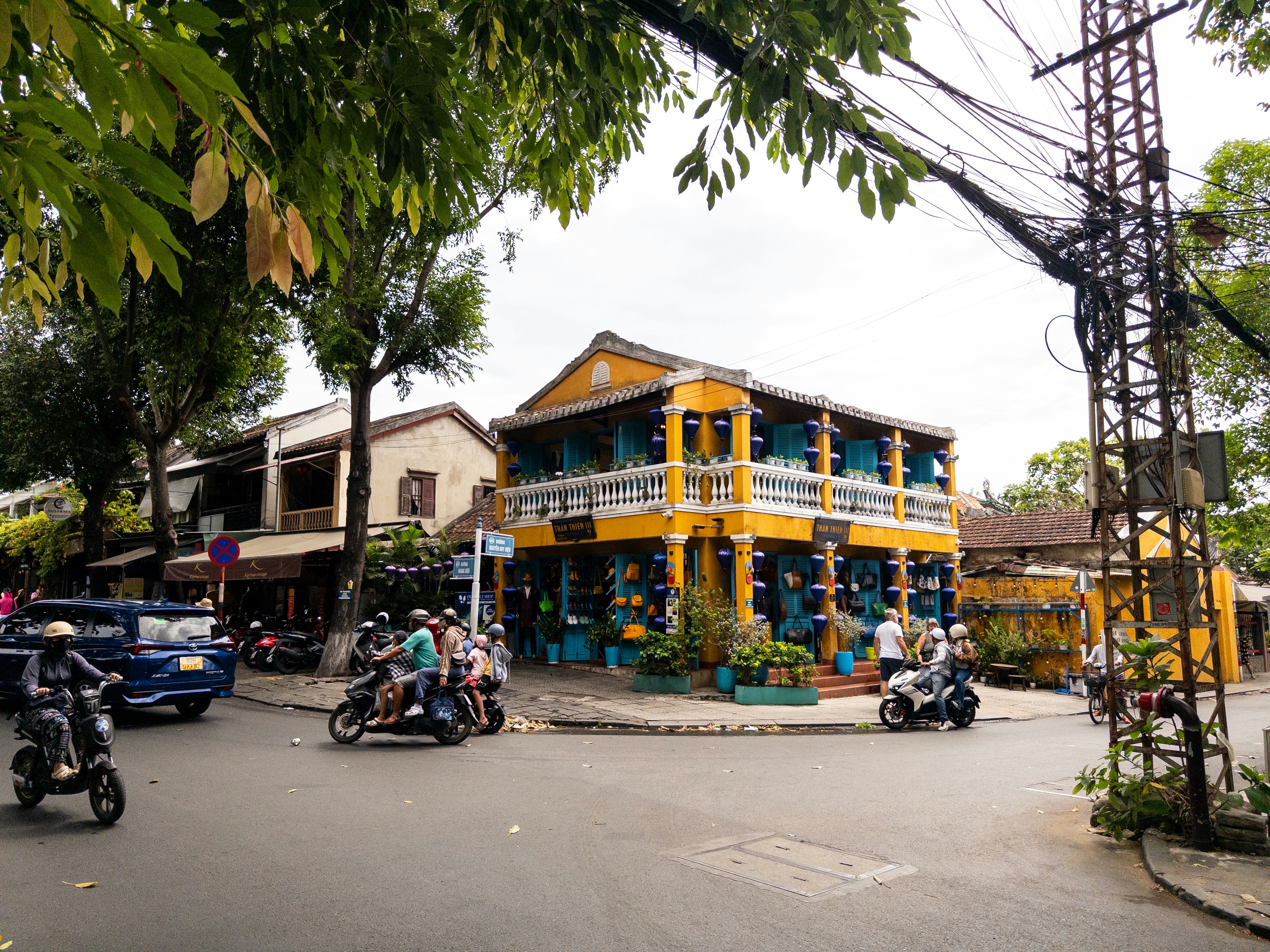 Colorful corner storefront amid a street scene