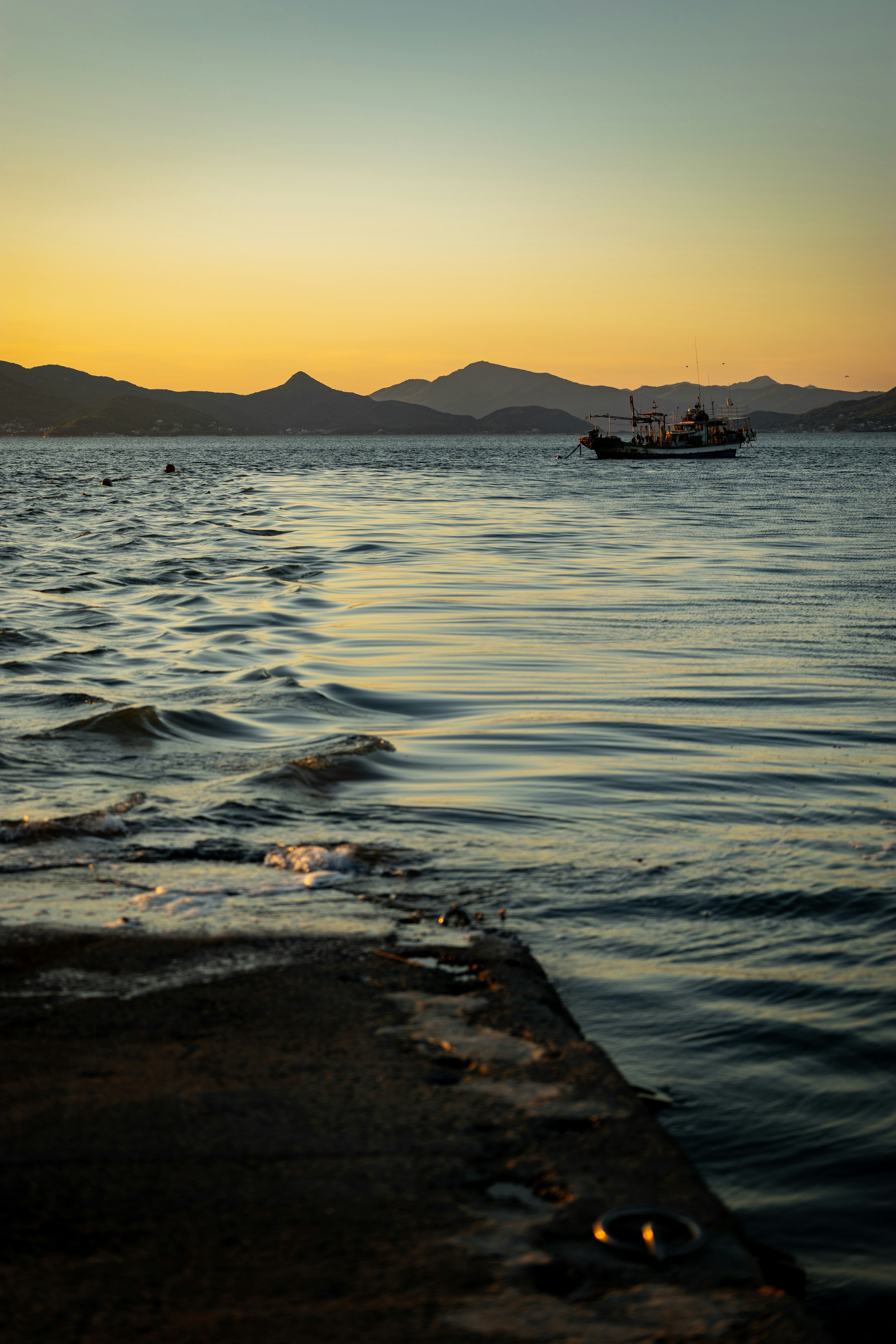 Sunset at the Hull: A Calm Harbor Under Gentle Waves