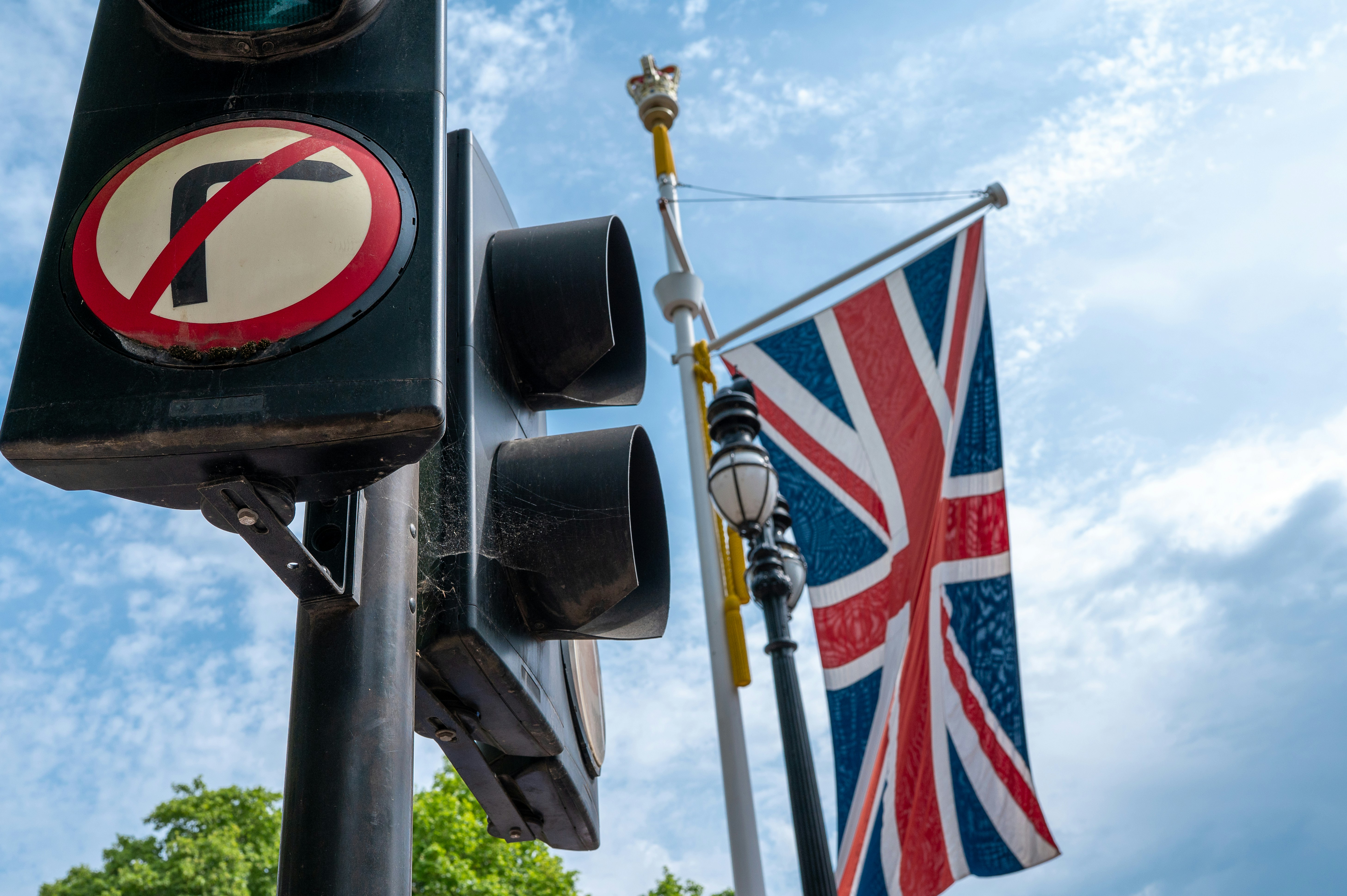 Union Jack and Red Retry: A Street Corner Under Blue Skies