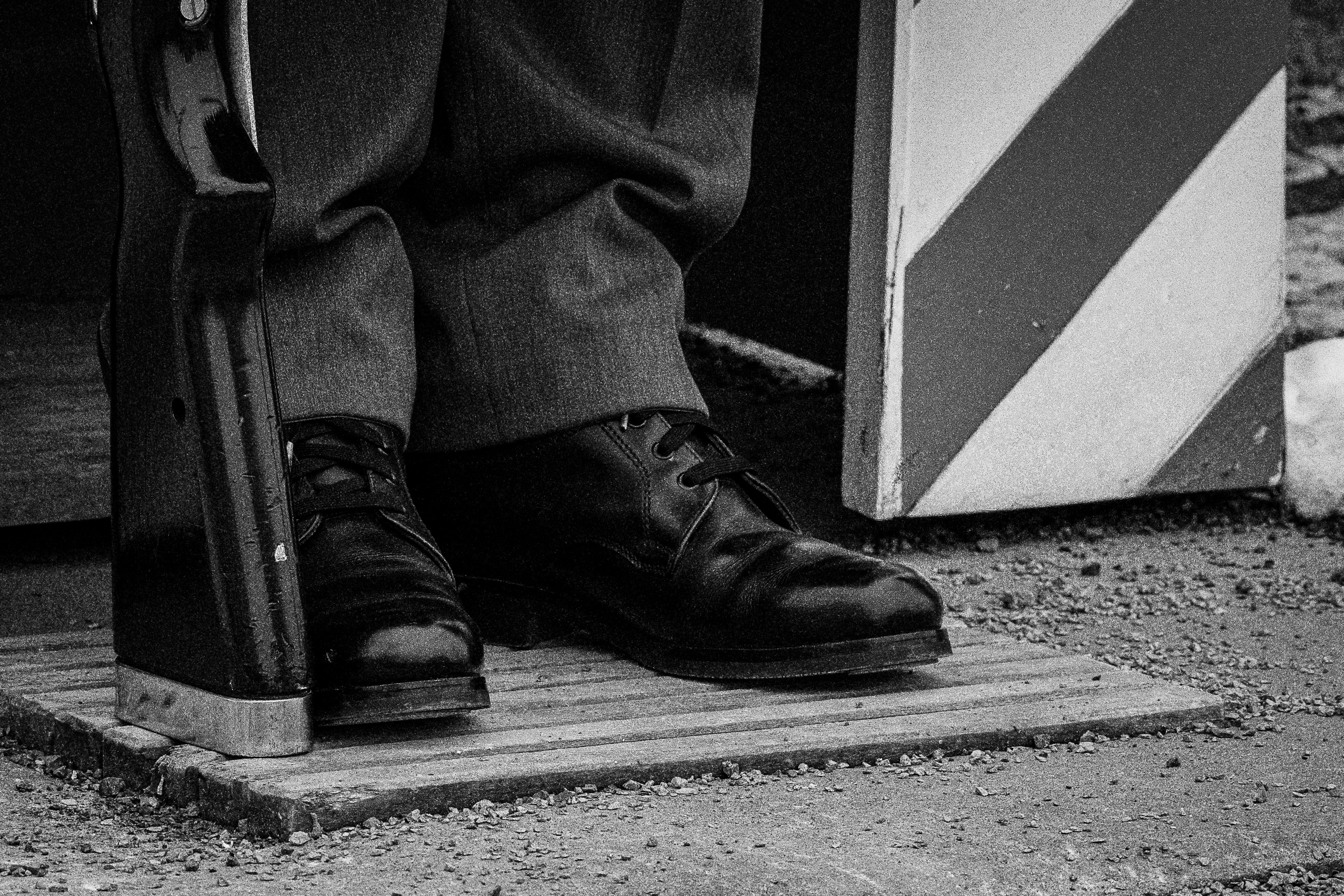 Boots on the Threshold: A Quiet Moment at the Edge