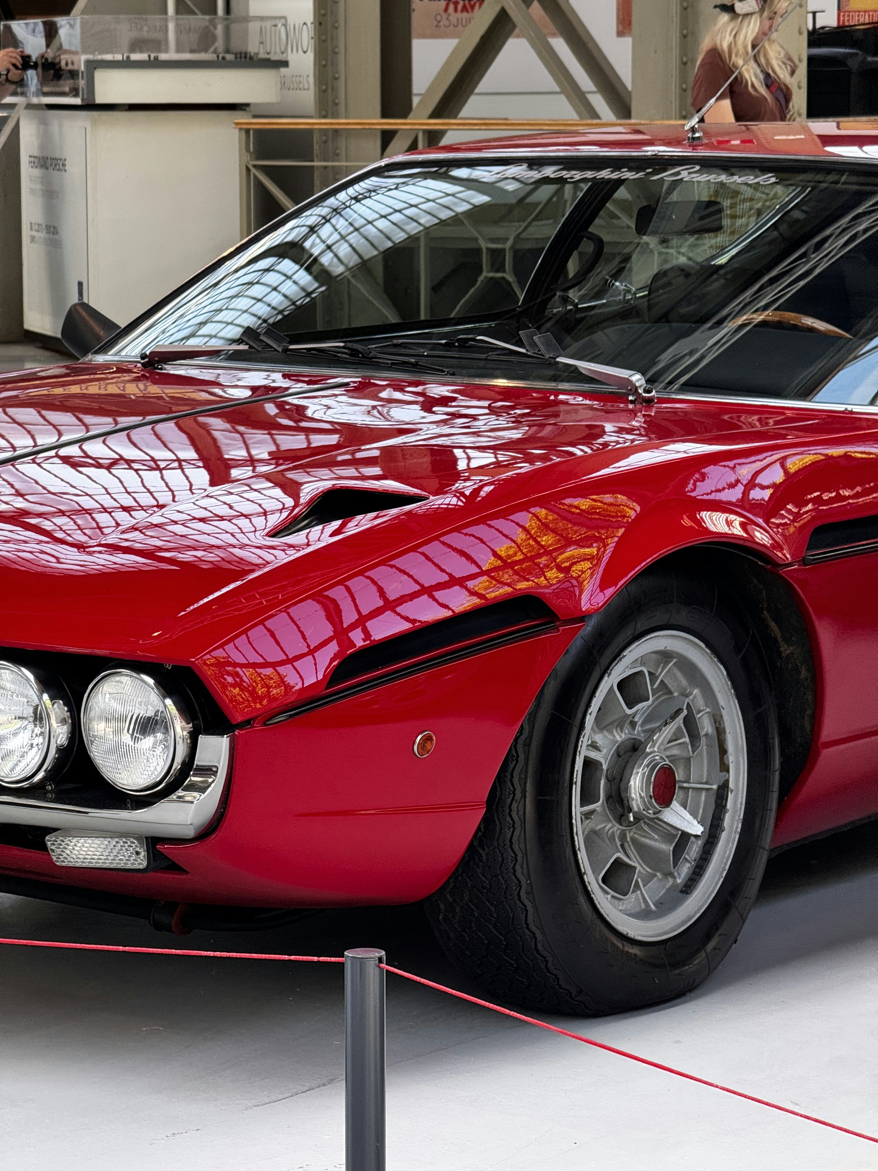 Crimson Classic: A Glimpse of Silhouette and Chrome at the Car Show