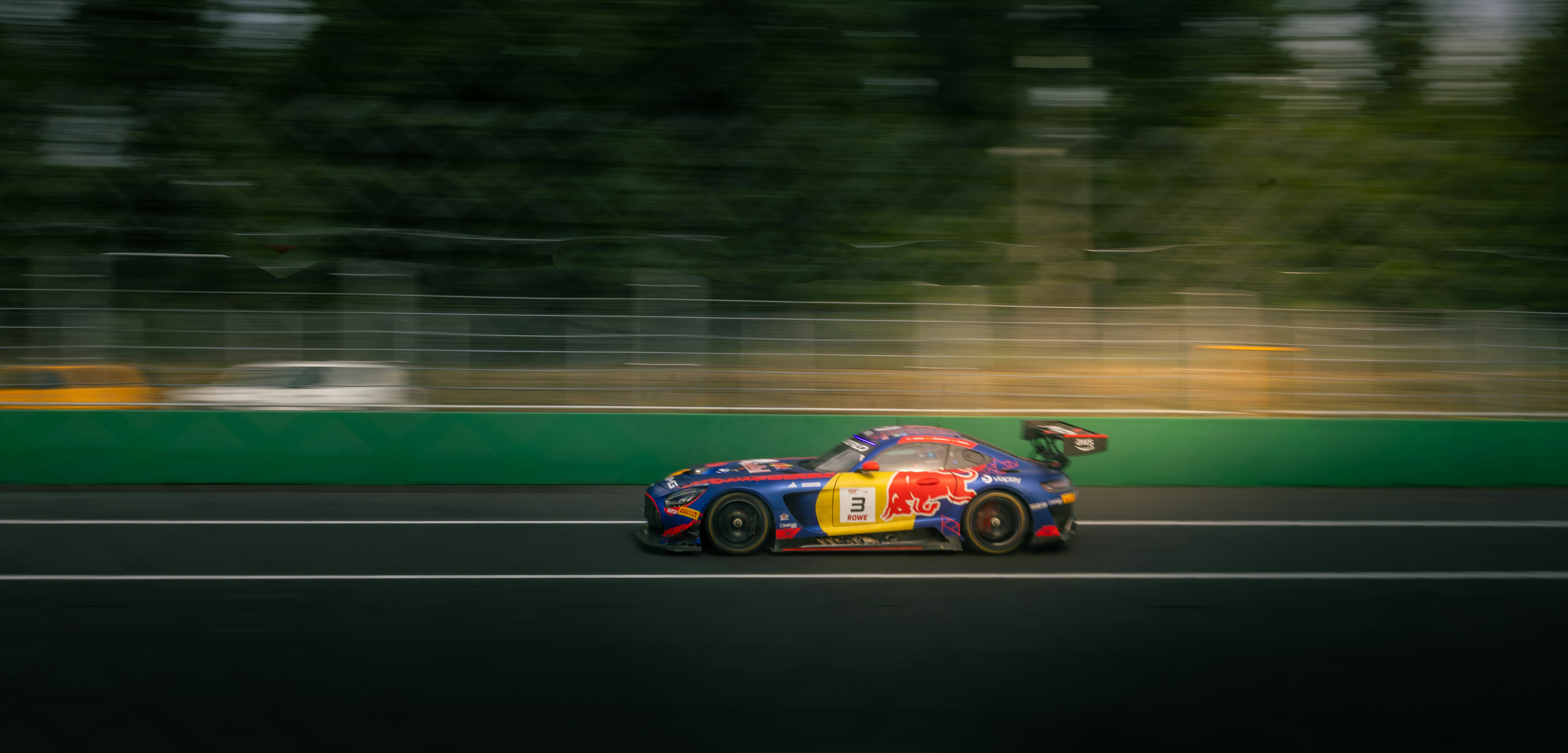 Fast Red Bull in a Green Hall: A Blurred Sprint on the Circuit