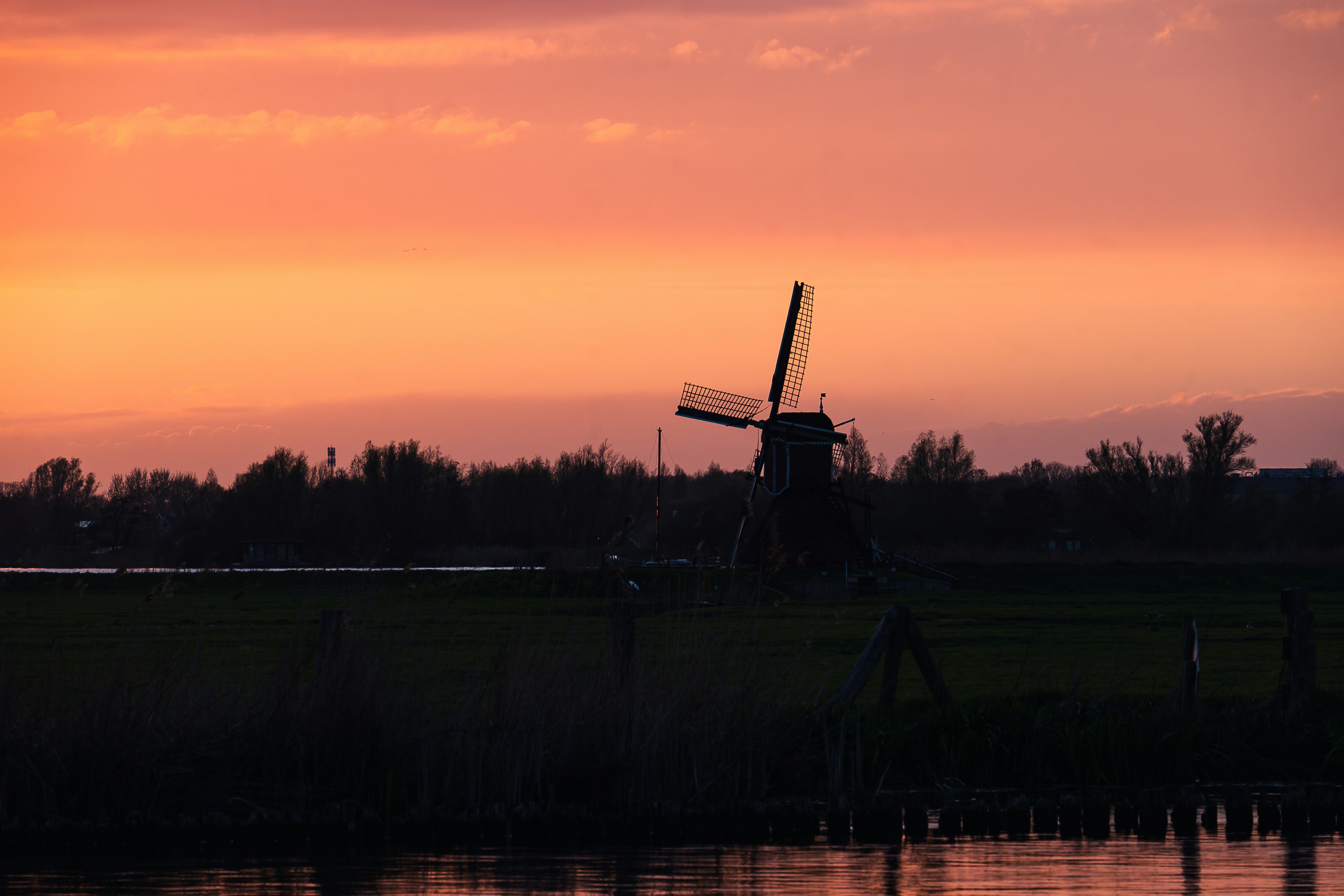 Silent Windmill at Sunset over Quiet Fields