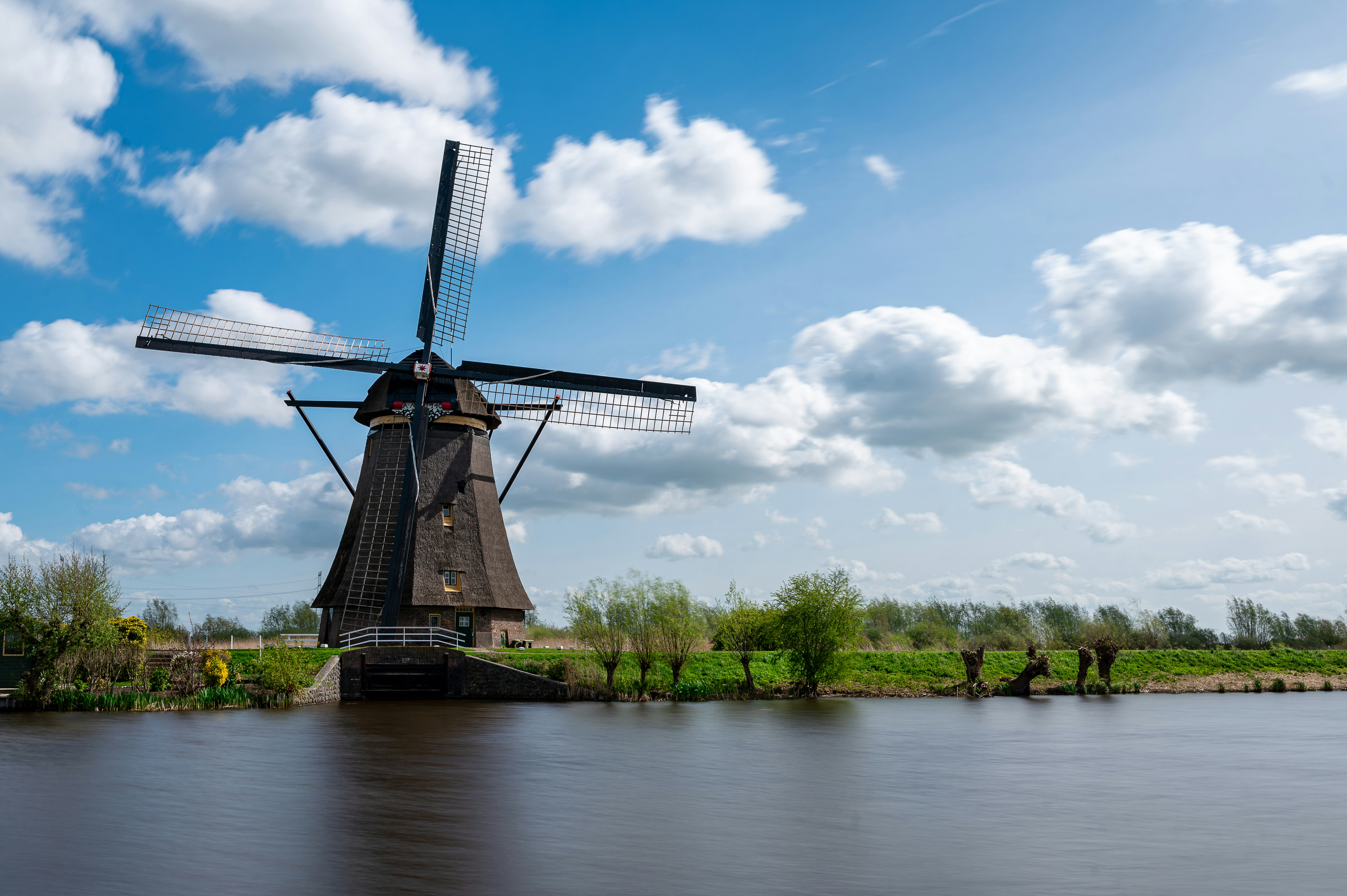 Windmill by the Dutch River: Dawn of a Sturdy silhouette
