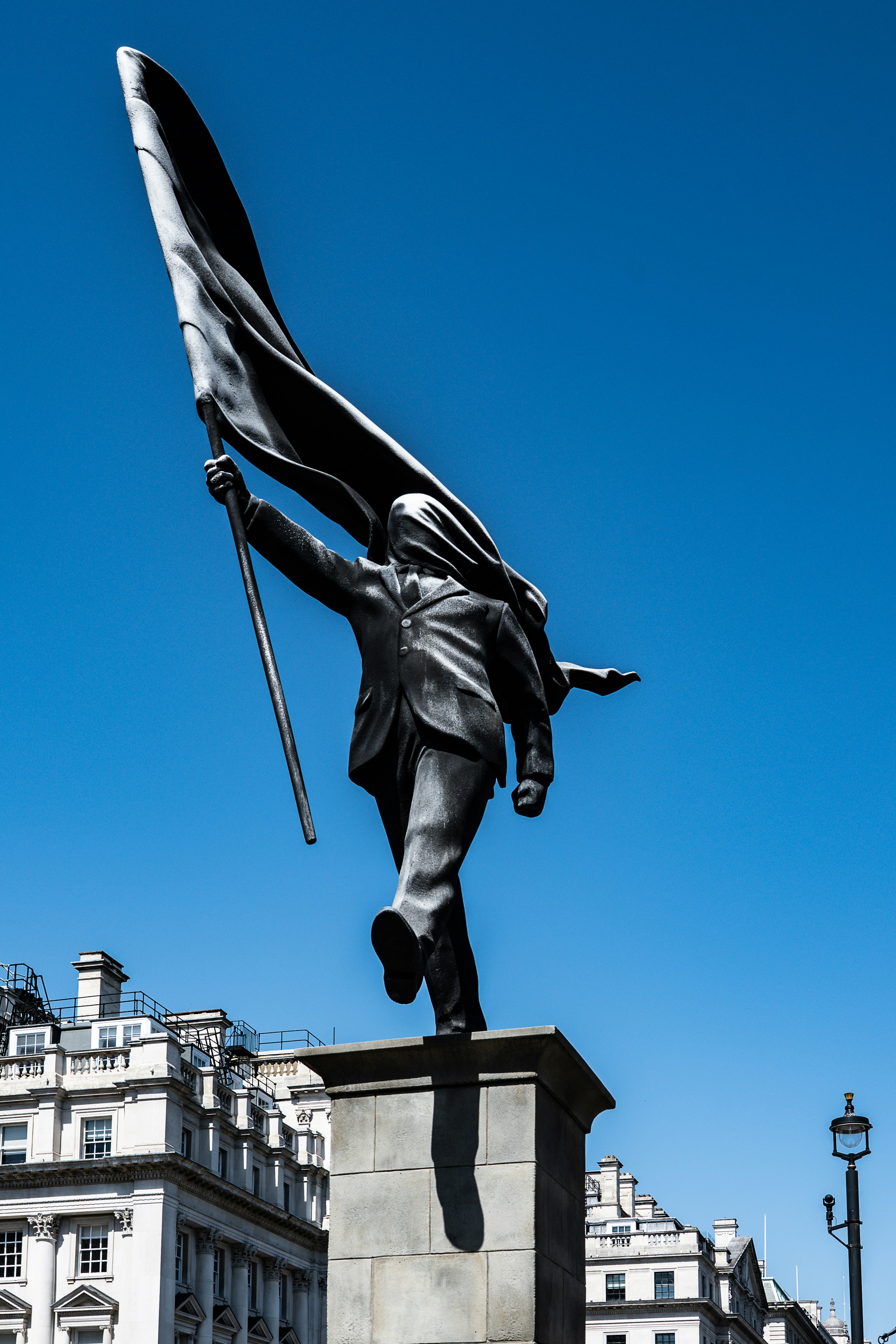 Flag-Bearer Over the City