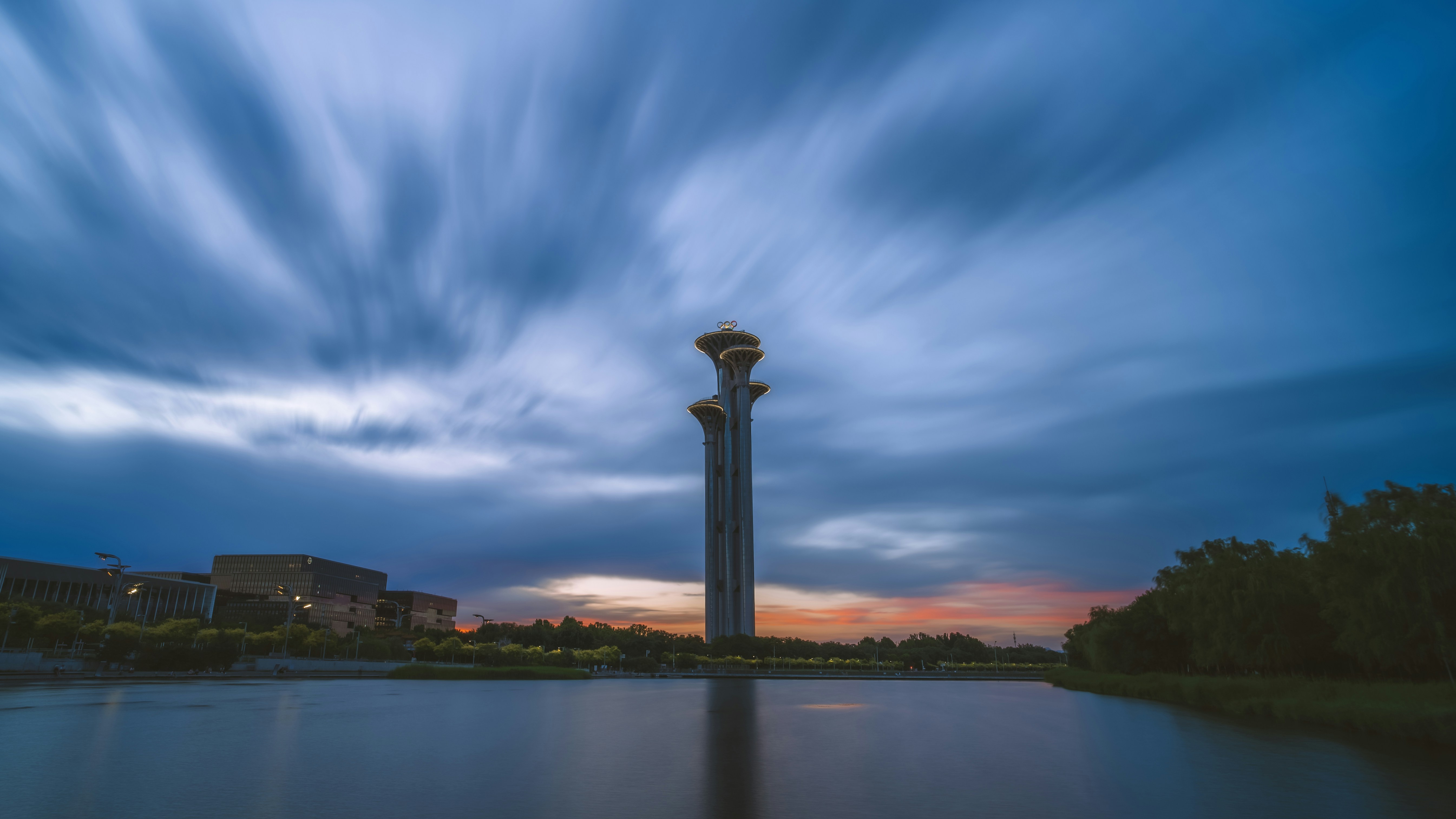 Tower in the Stillness: Sunset over the Riverside Spire