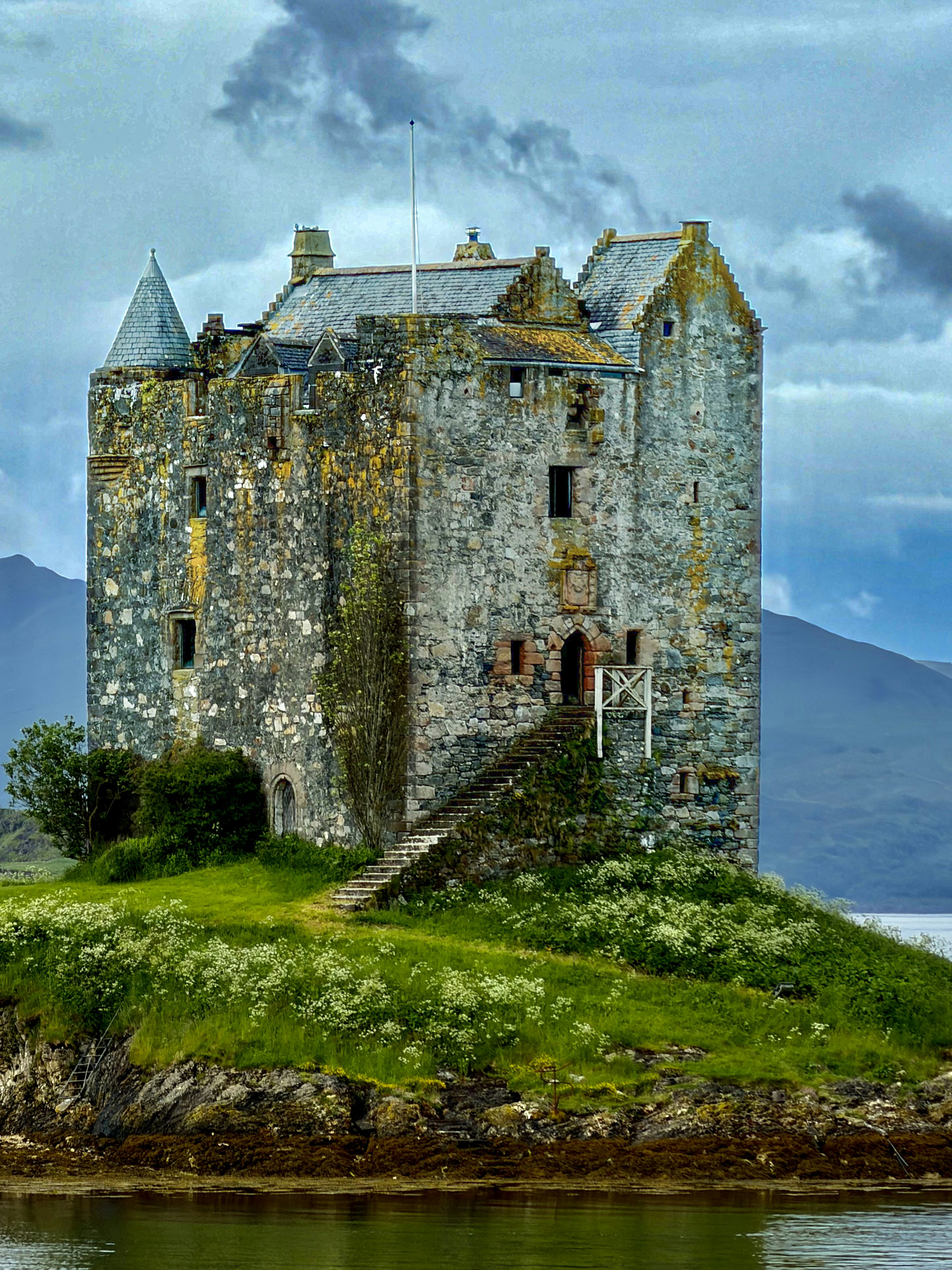 Stone Sentinel: A Highland Keep Standing Over Quiet Waters