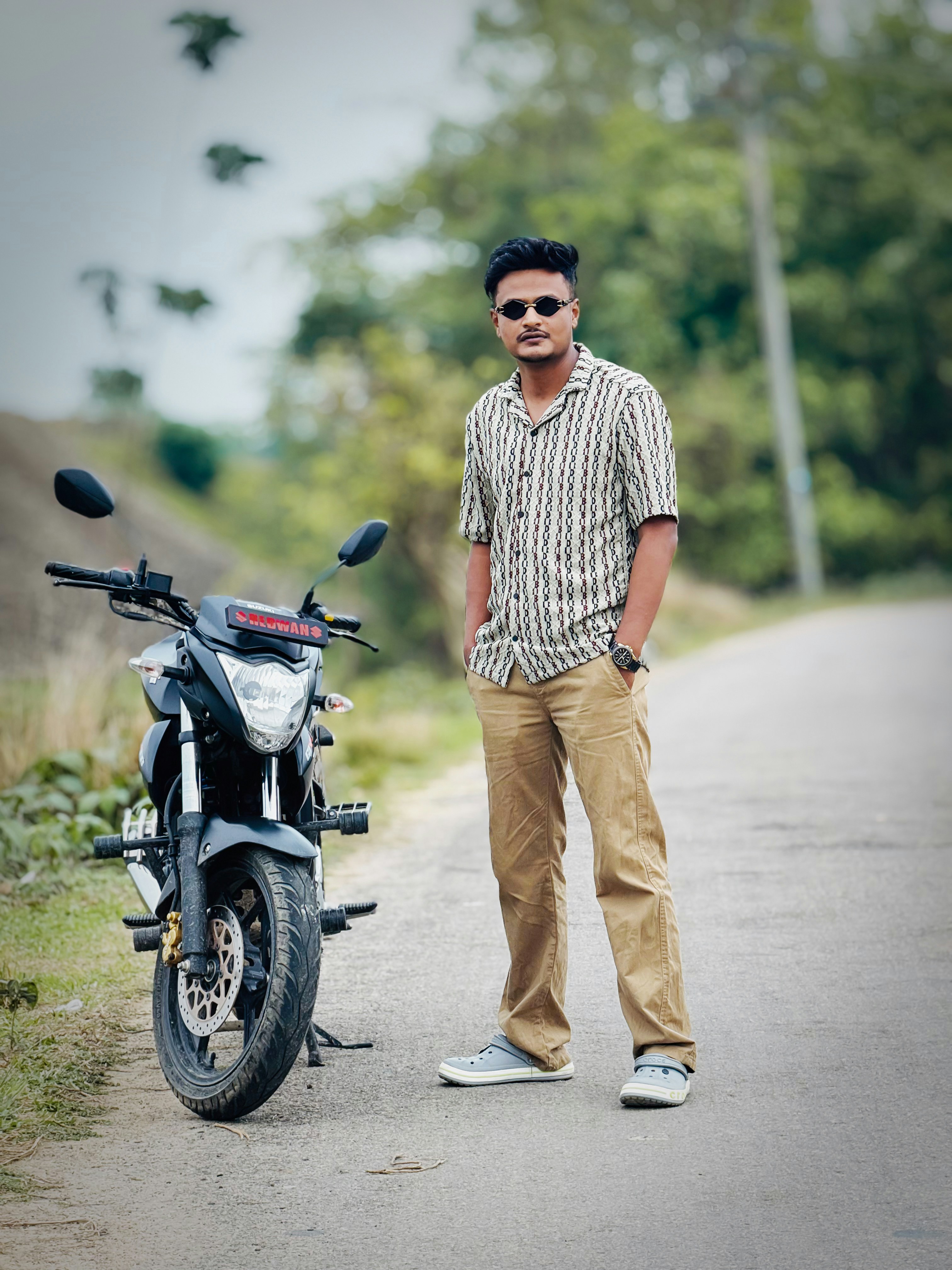Standby Rider: A Calm Pose by the Roadside Bike