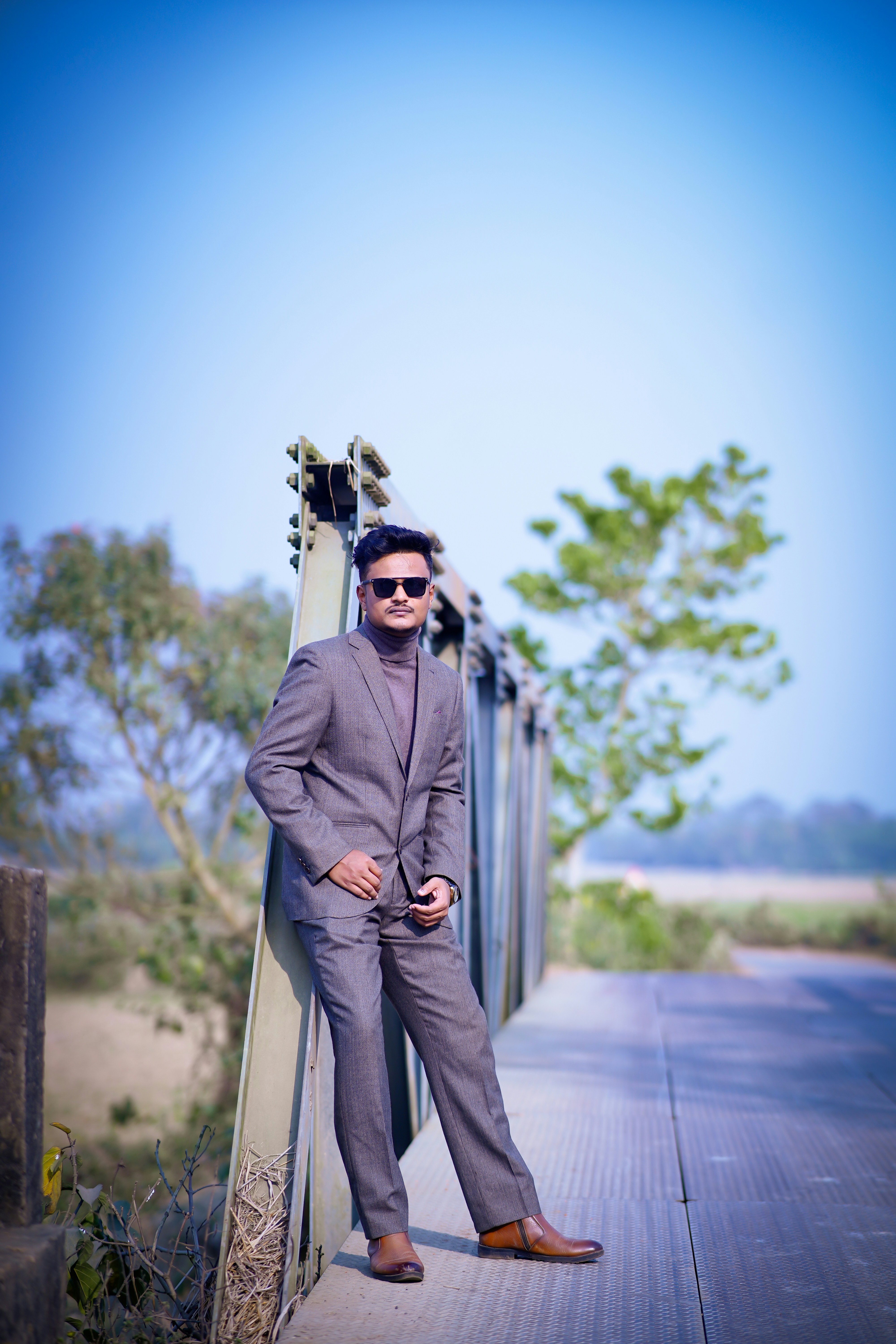 Gentleman at the Bridge: Quiet Confidence in Grey Tones