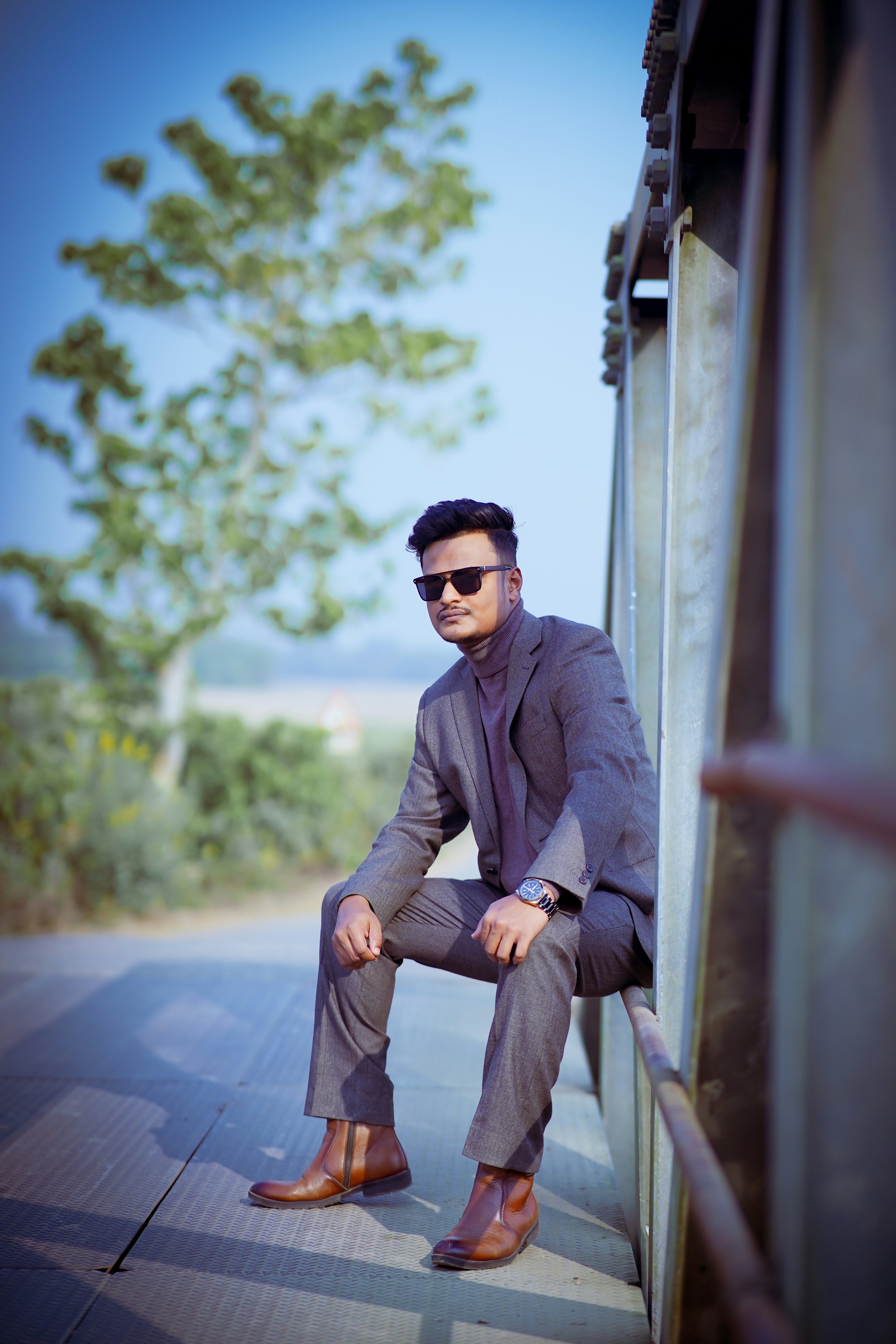 Serrated City Cool: A Suited Figure on the Rail