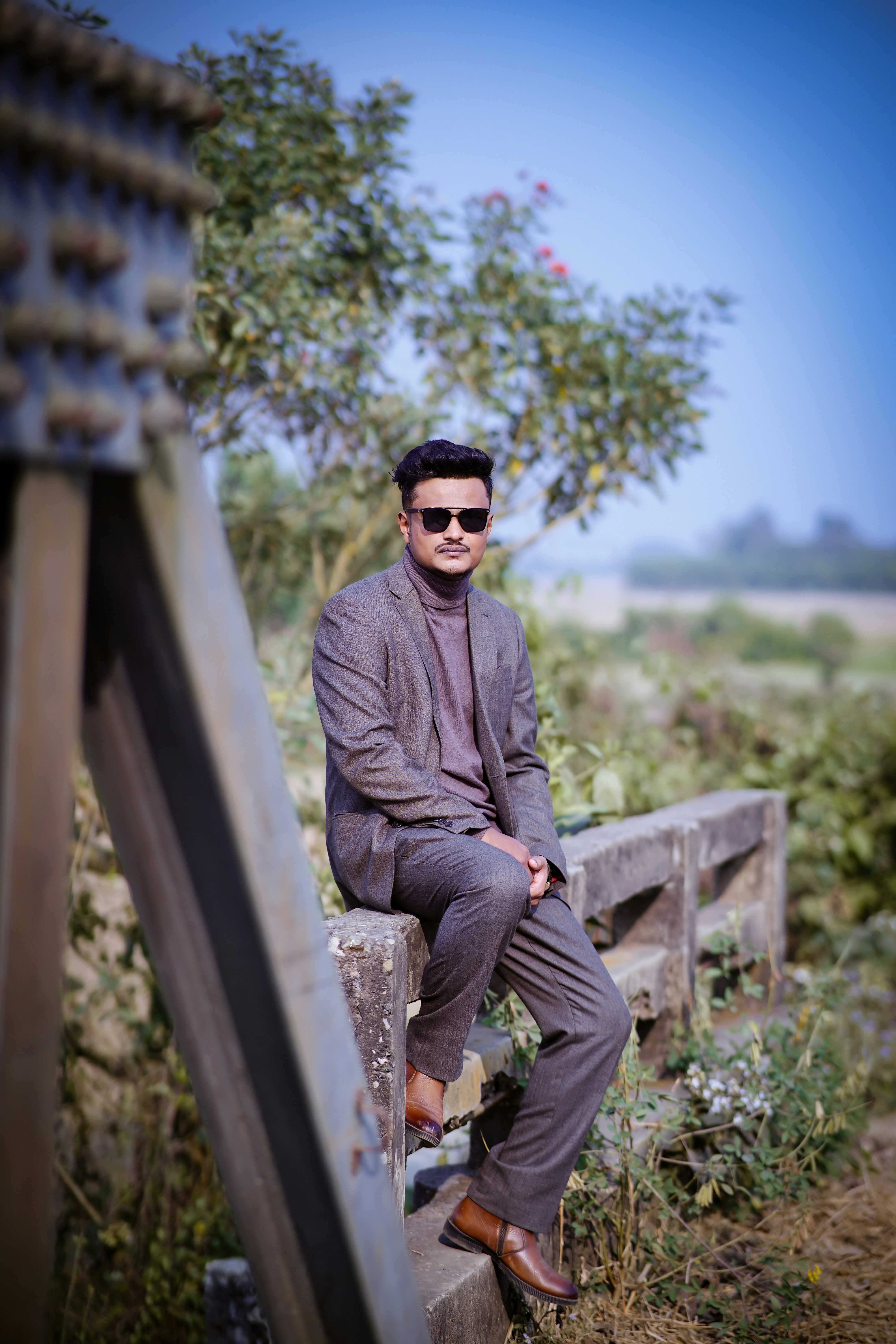Portrait on the Platform: A Suited Moment by the Rail