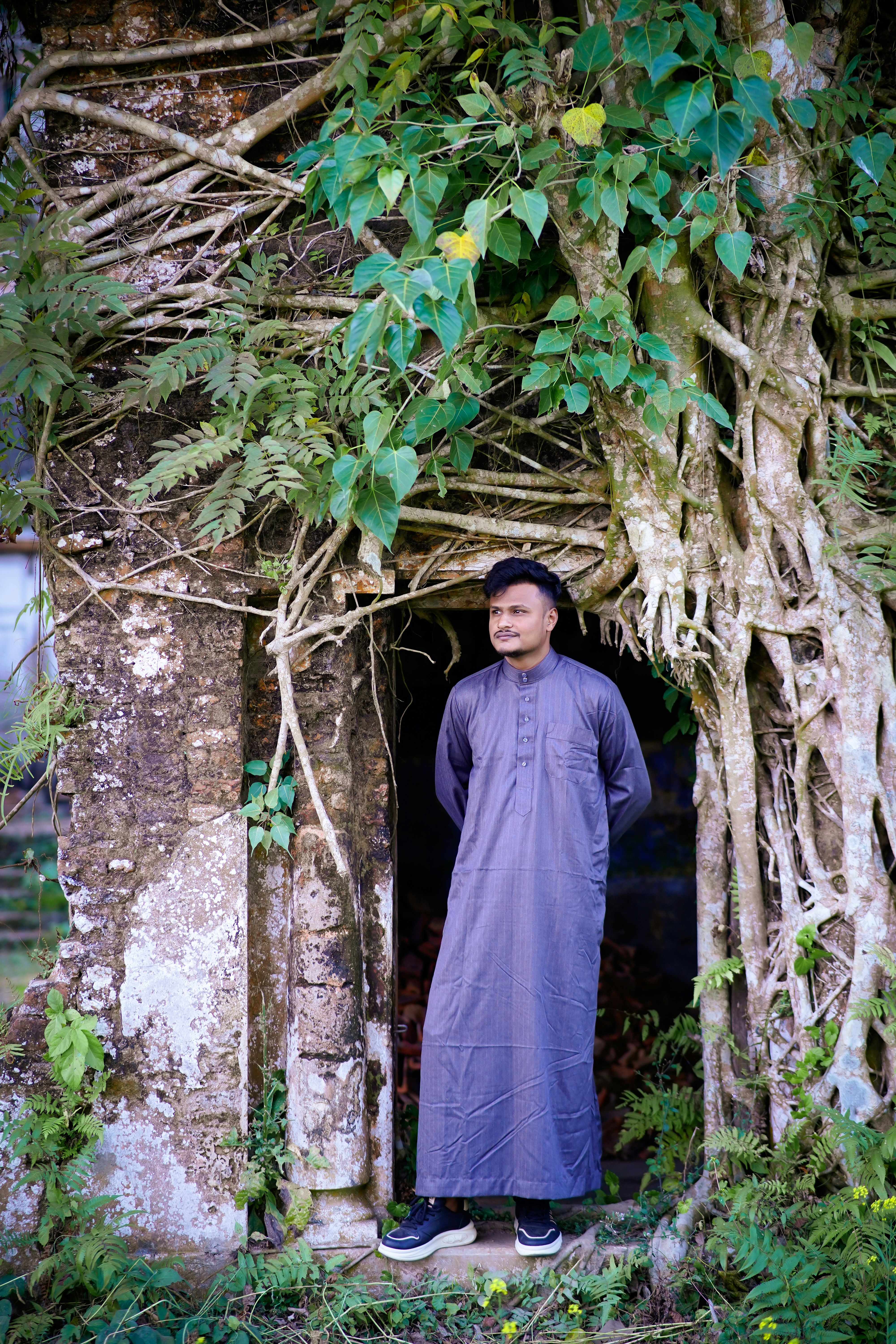 Threshold of Green: A Quiet Portrait in an Ivy-Wrapped Archway