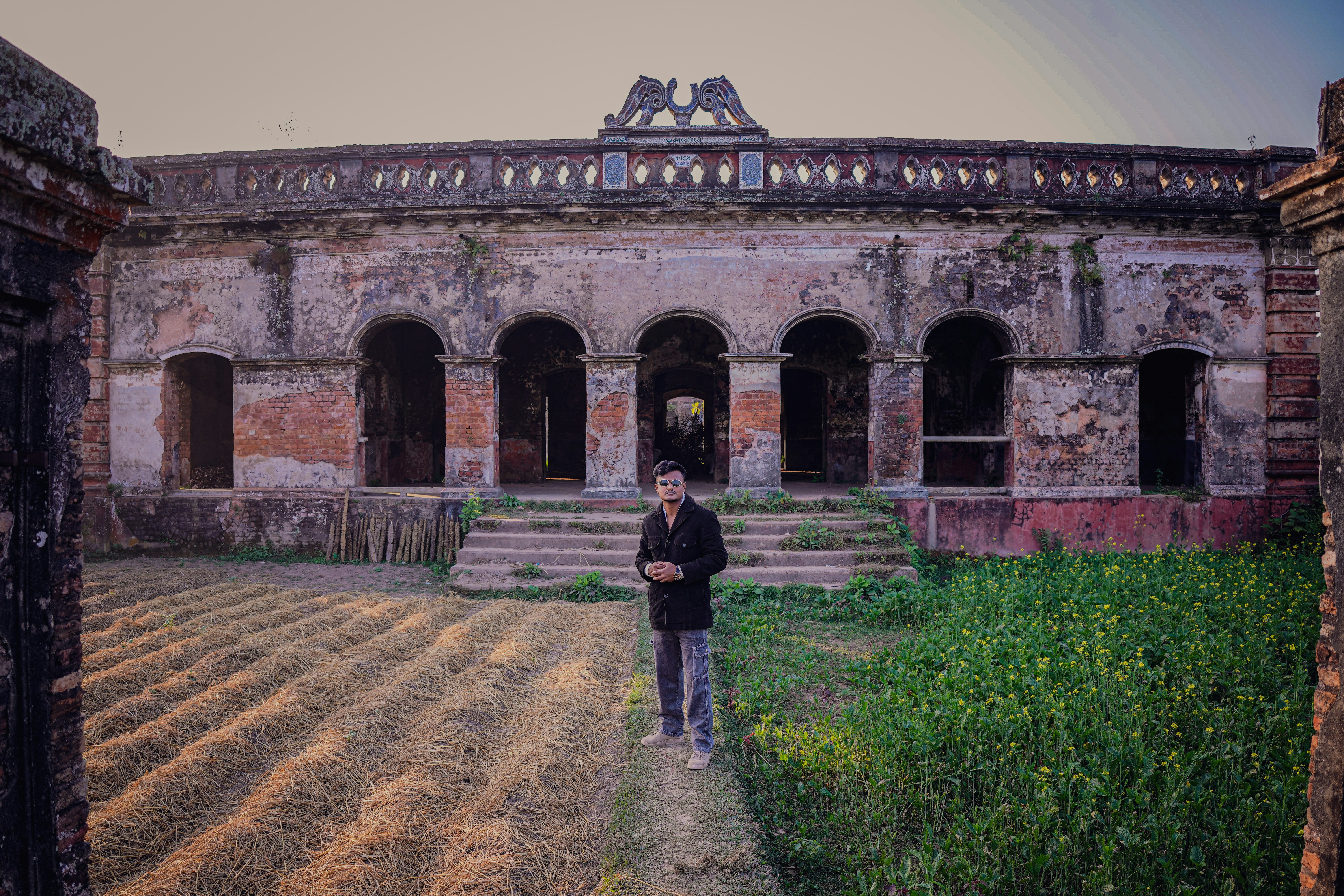  solitary figure at the threshold of a ruined cloister