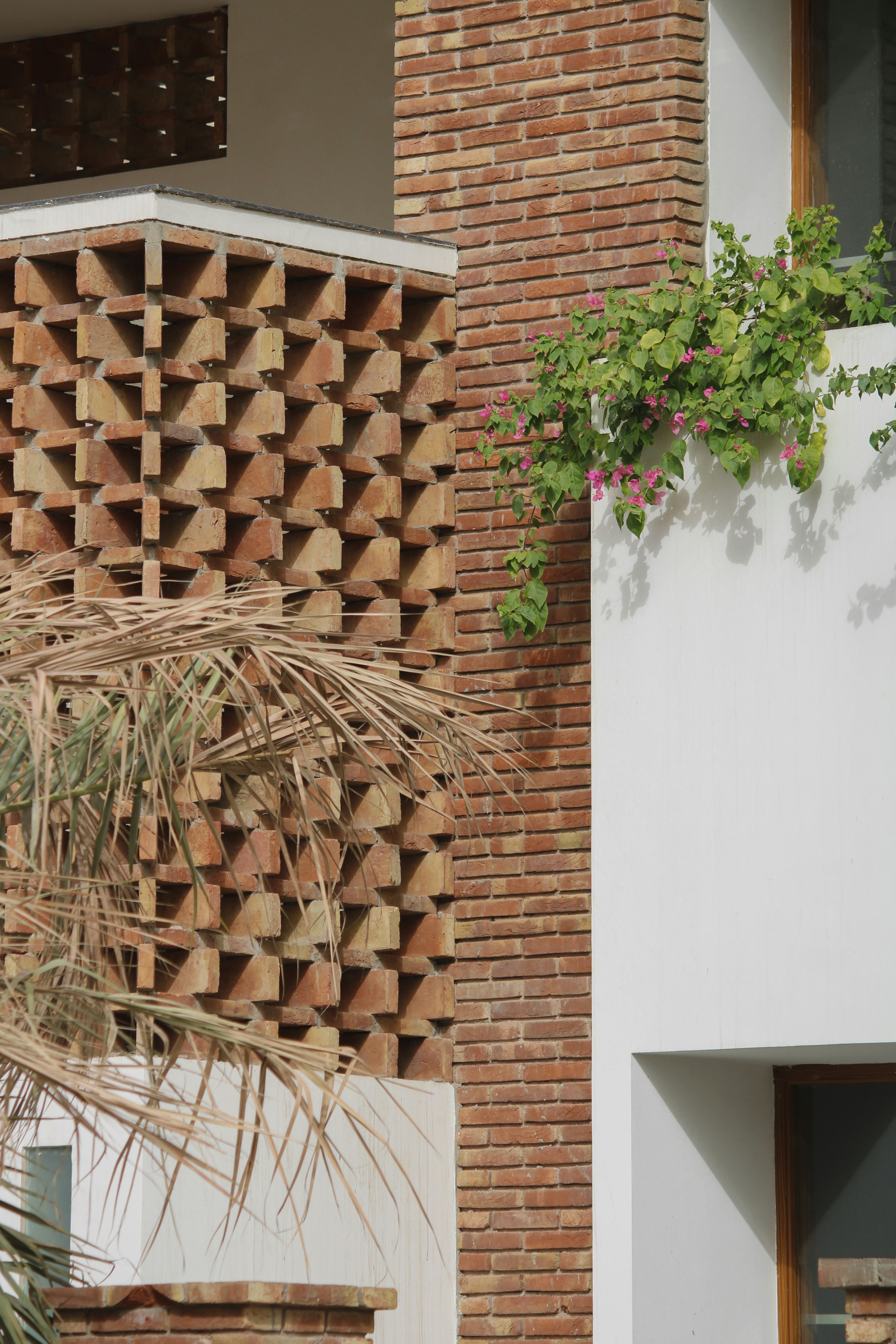 Brick and White Facade with Greenery Cascade
