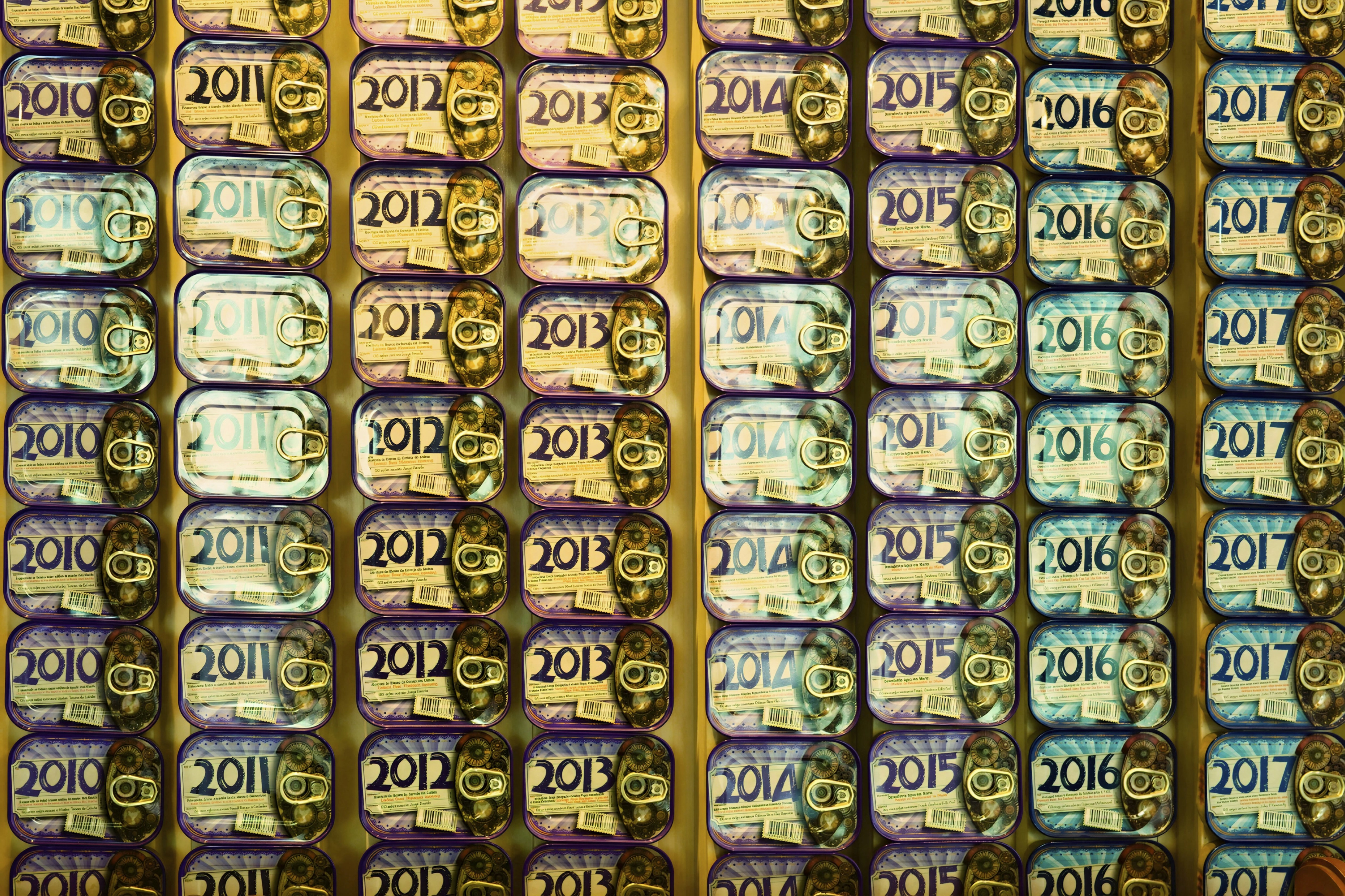 Colorful Grid of Year-Marked Tin Cans