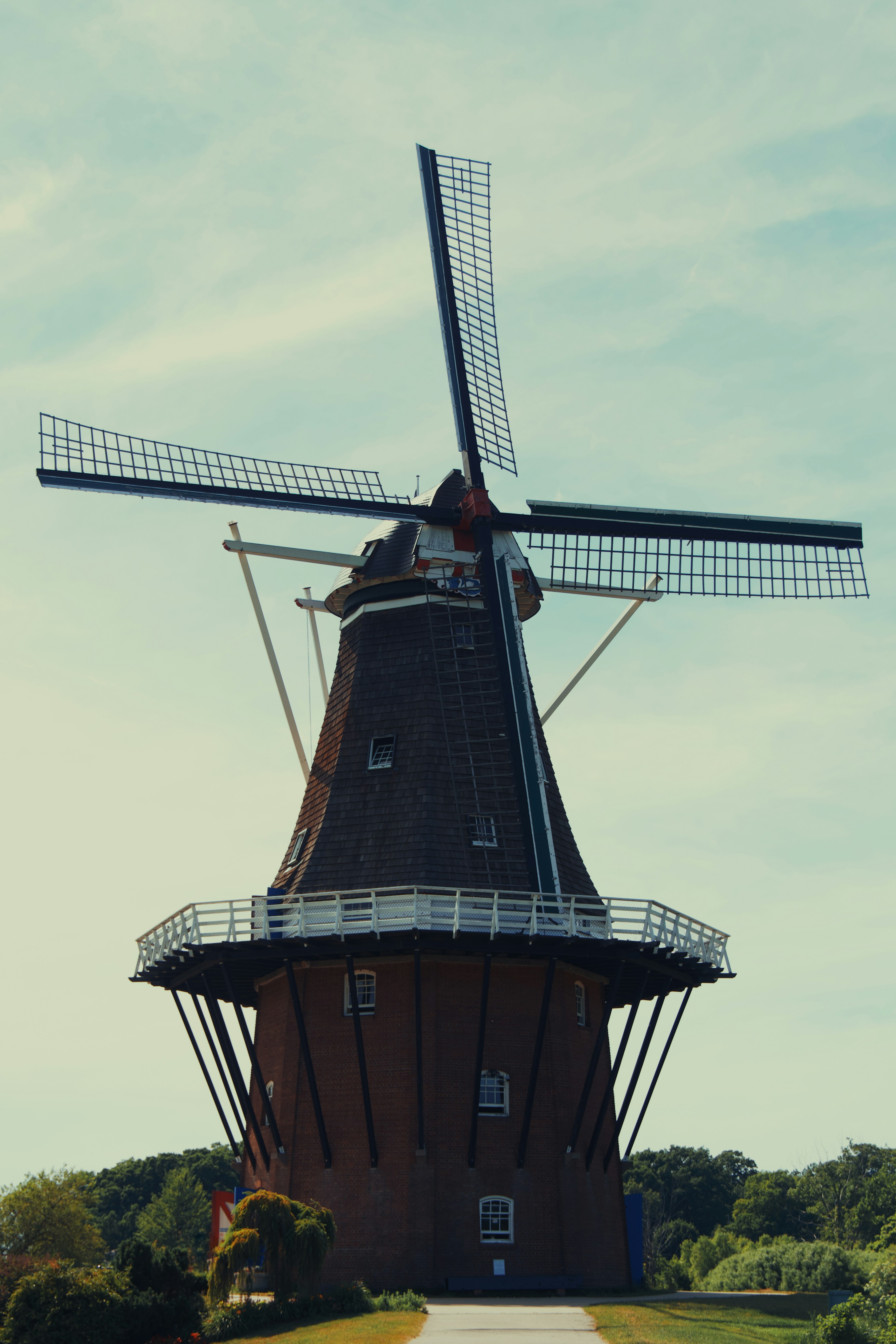Windmill Beacon: A Classic Dutch silhouette under a pale afternoon sky