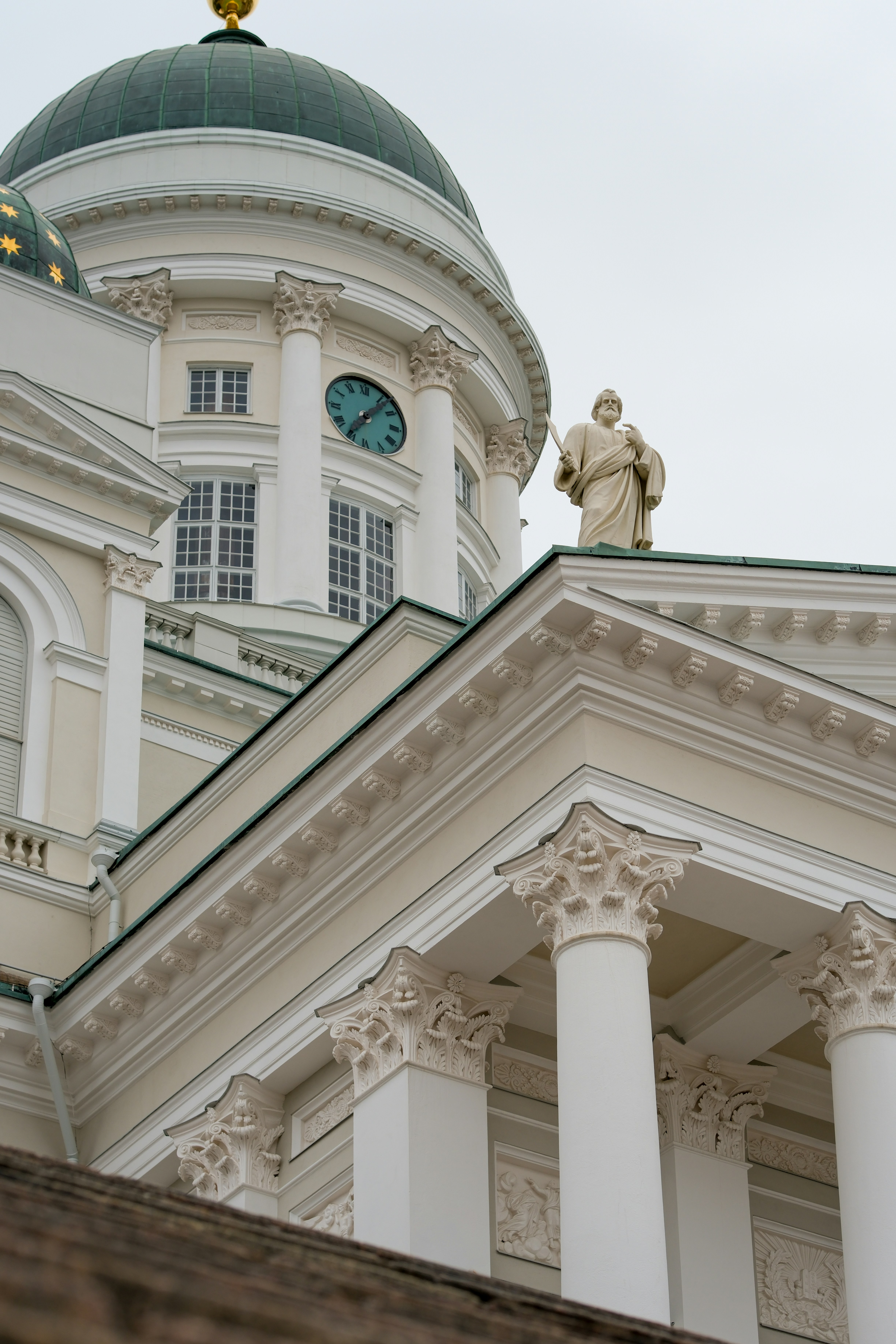 Clocktower Cathedral: Classical Cartouche and Statue Above Green Dome