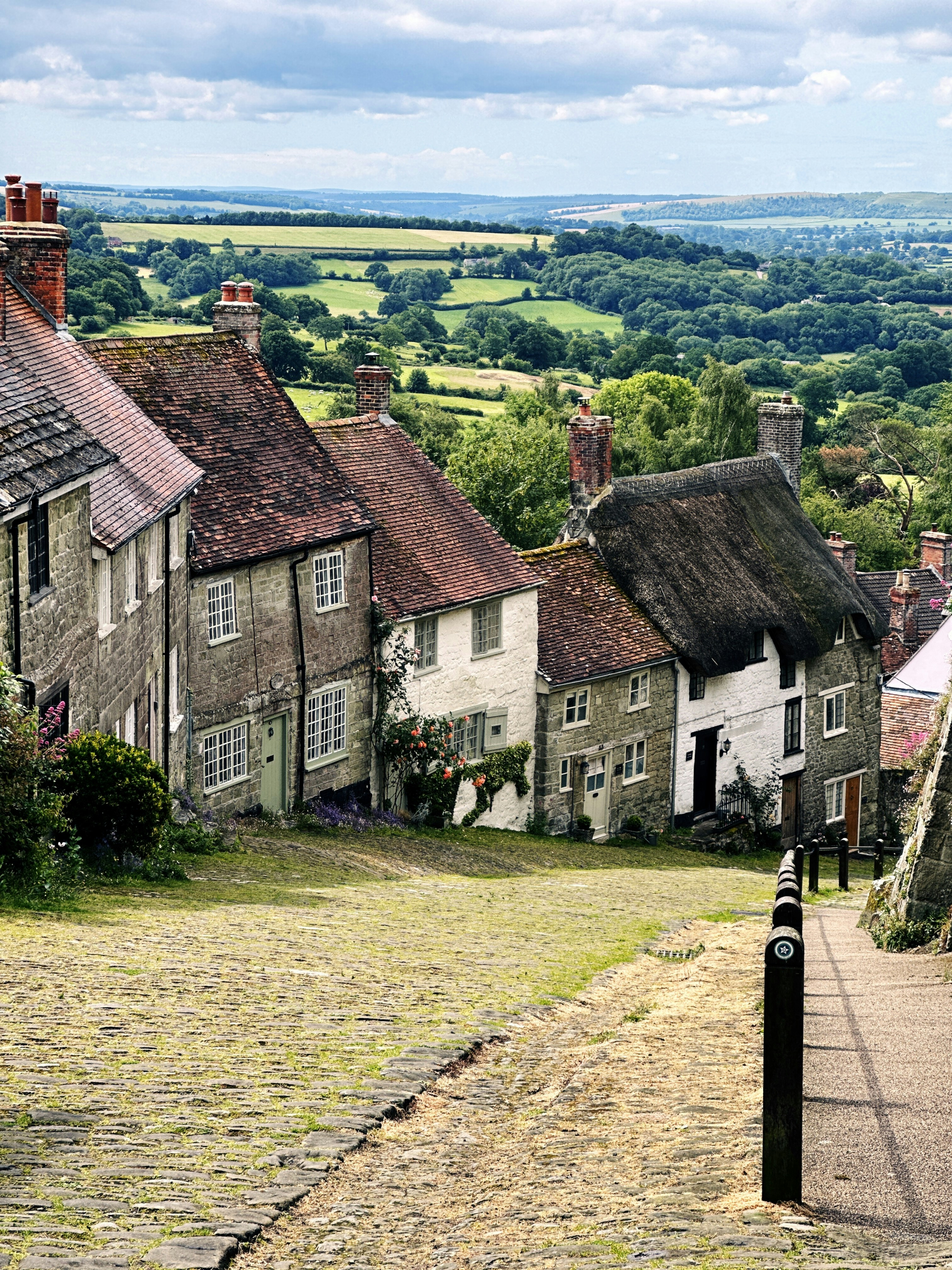 Cobbled Street Descending Through a Timeless English Village