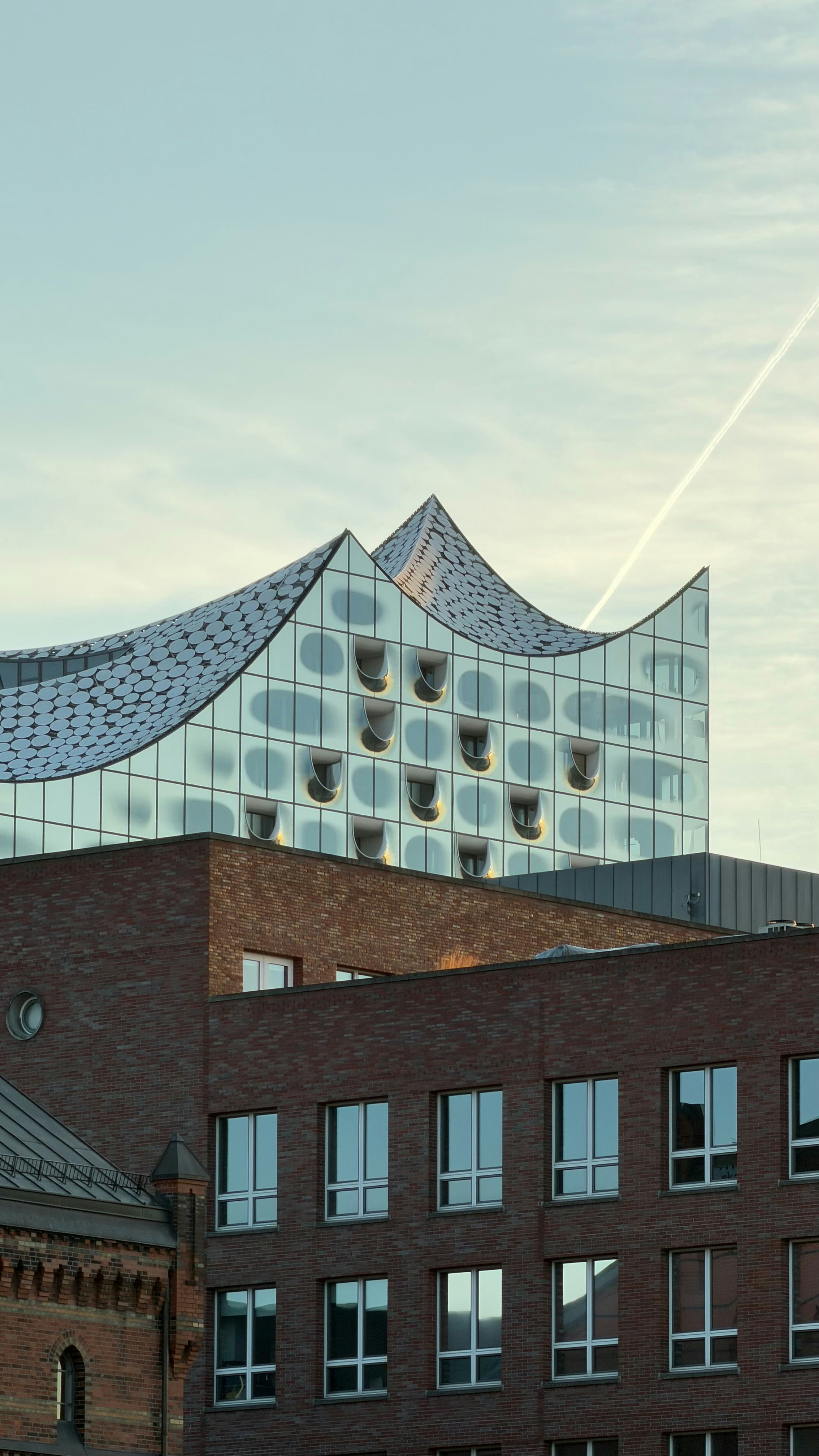 Urban Wave: Glass Facade and Brick Skyline