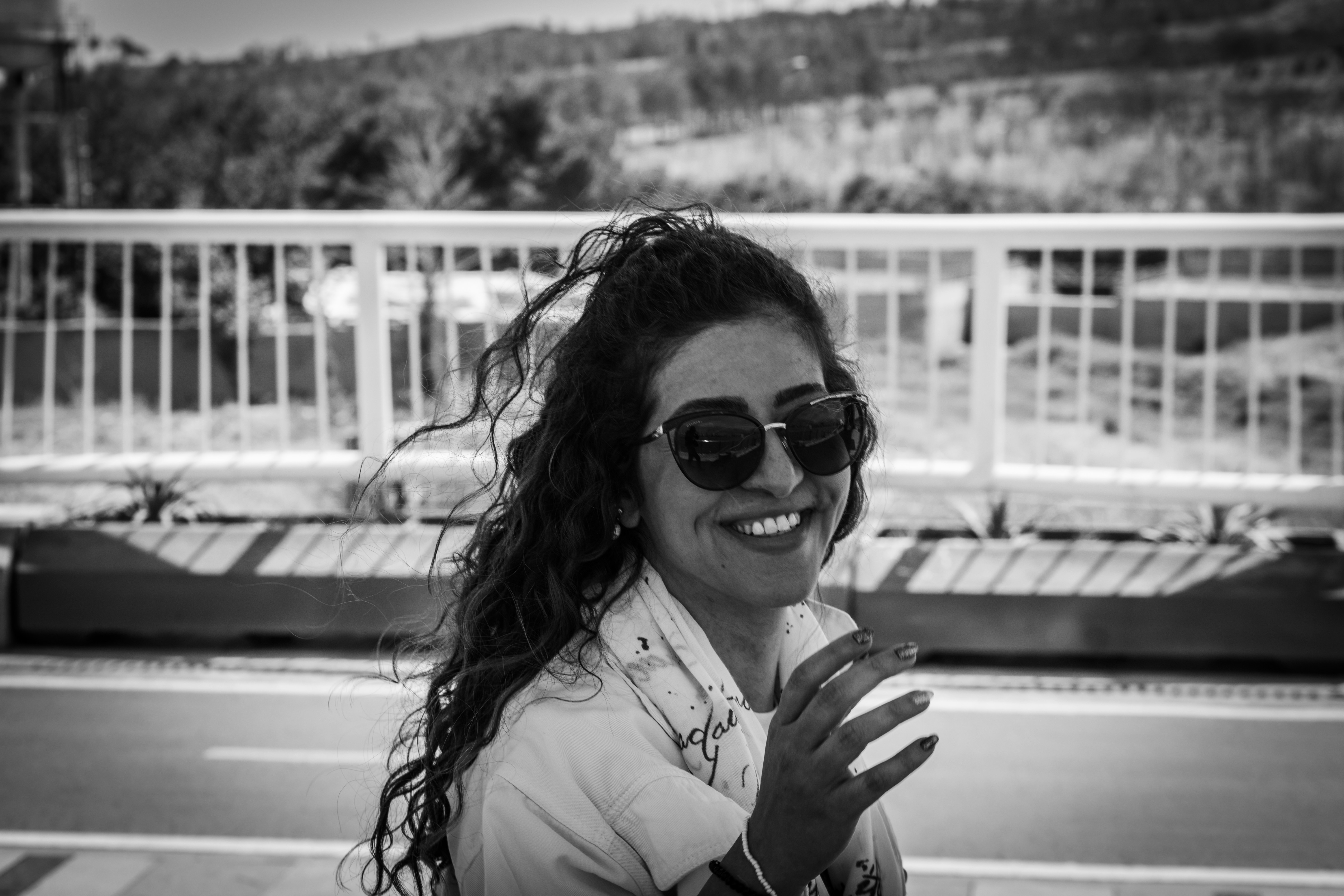 Smiling stride: a sunlit portrait on a rooftop