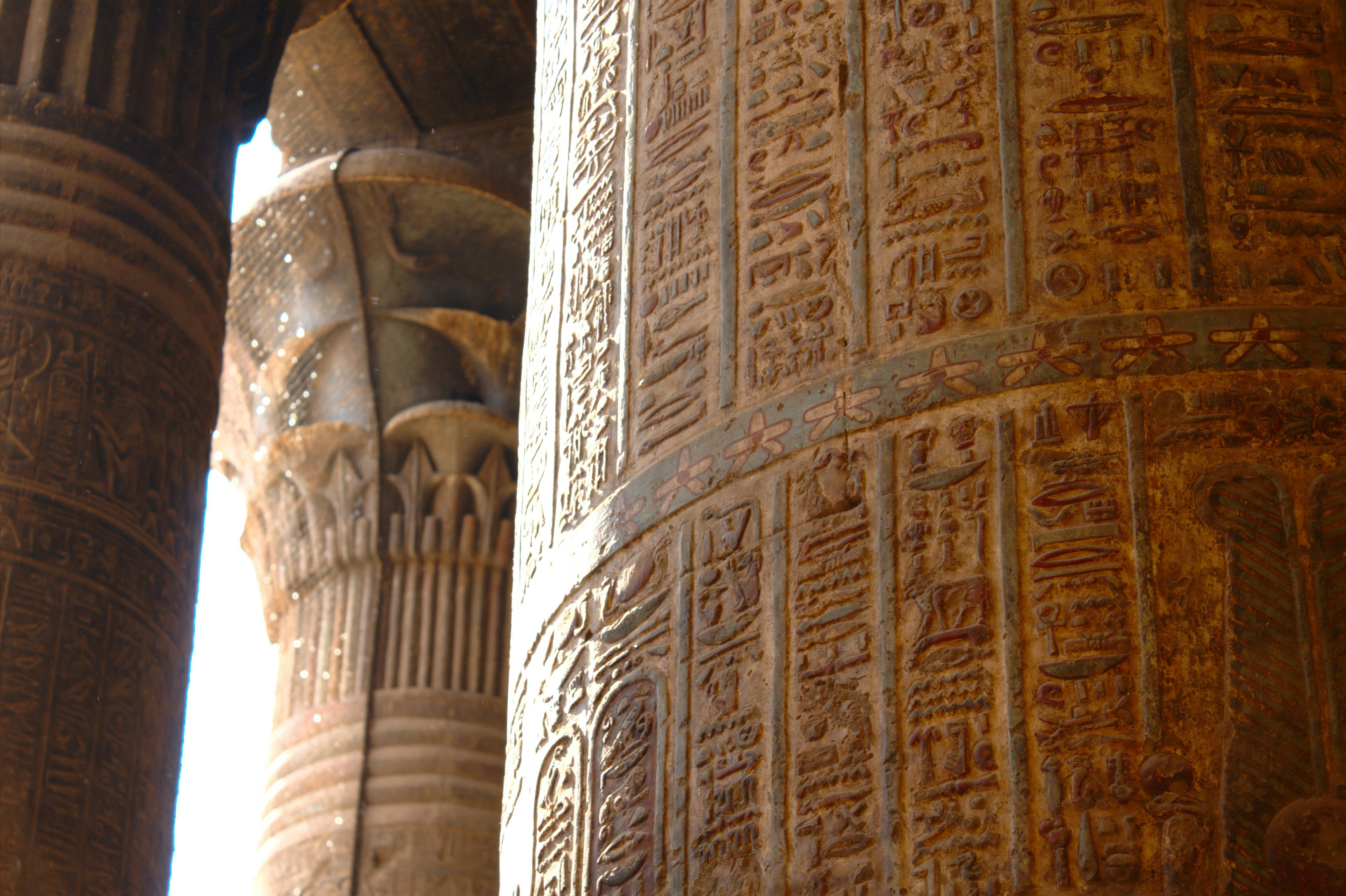 Carved Hieroglyphs on Ancient Columns: Time-worn Details in Massed Pillars