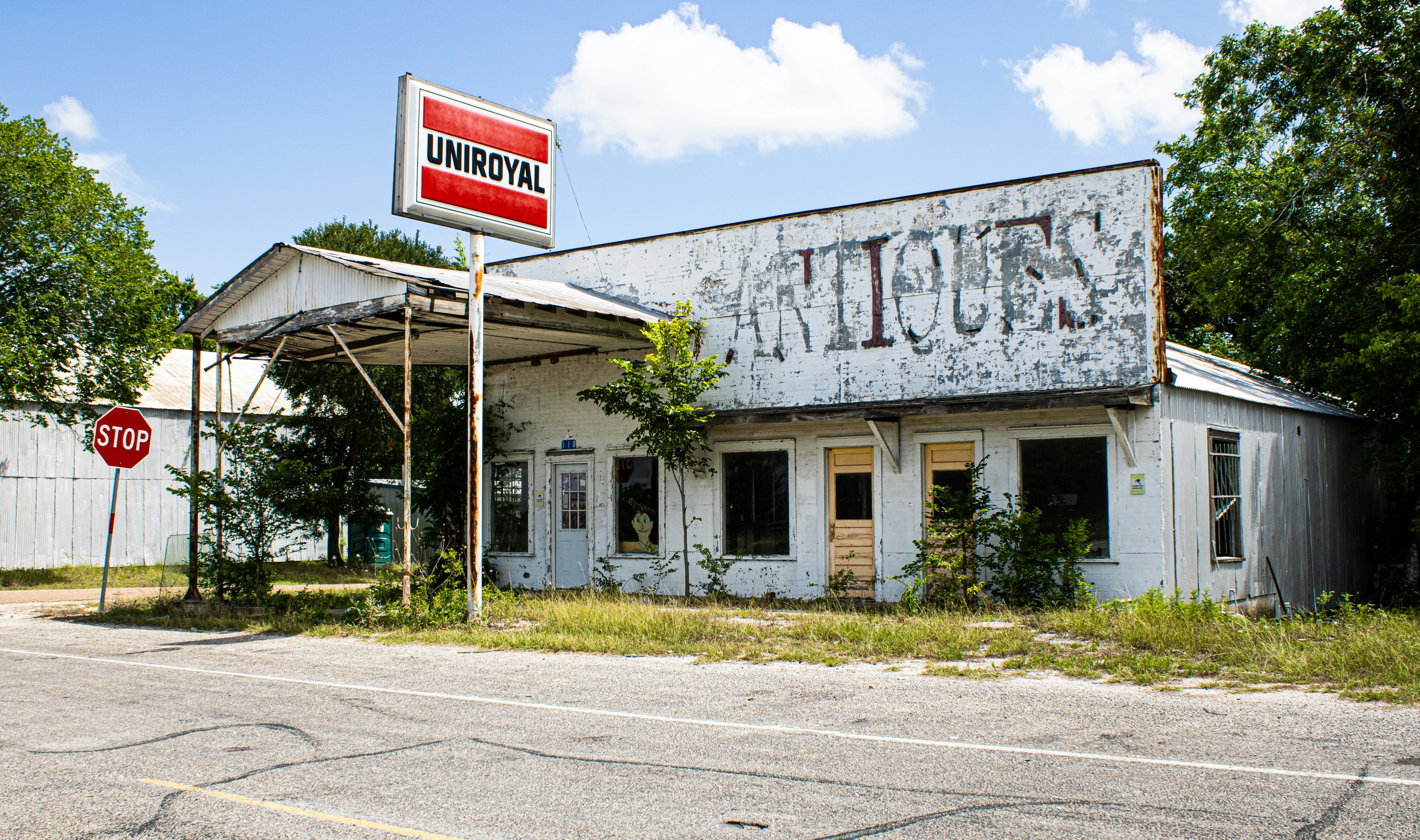 Abandoned Texan General Store: Weathered Facade and Forgotten Signage