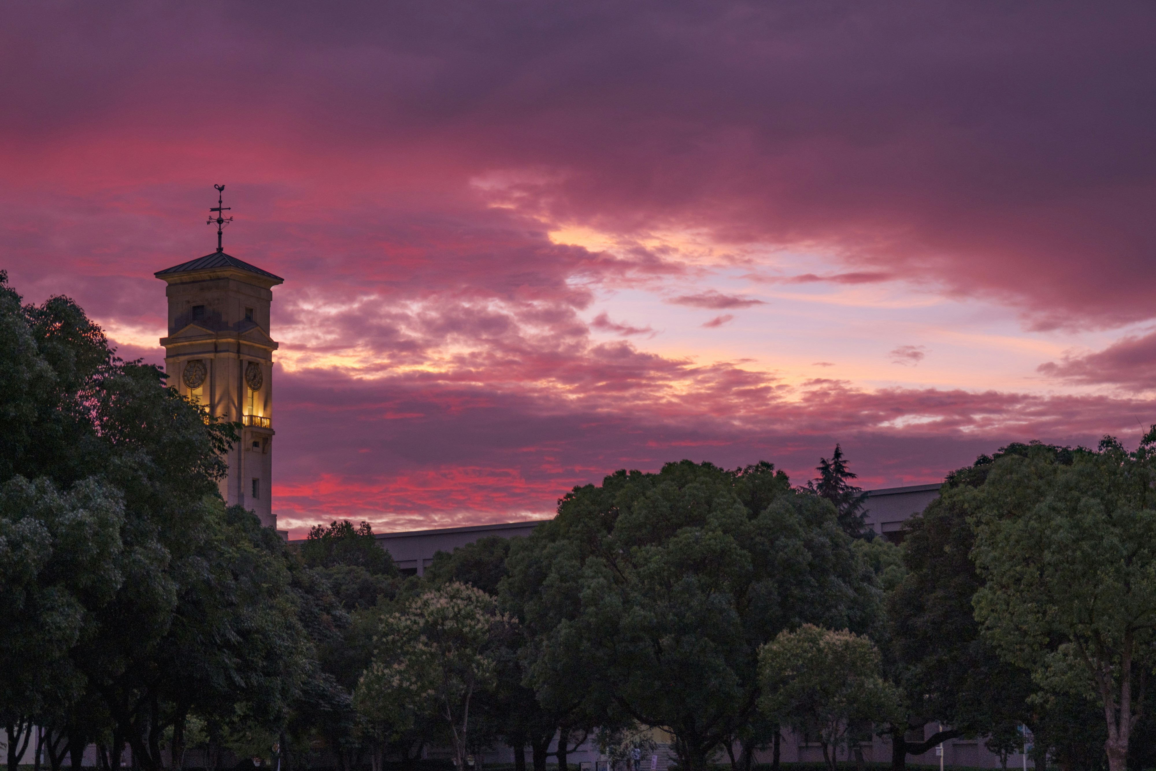 Old Clock Tower Beneath a Painted Sunset