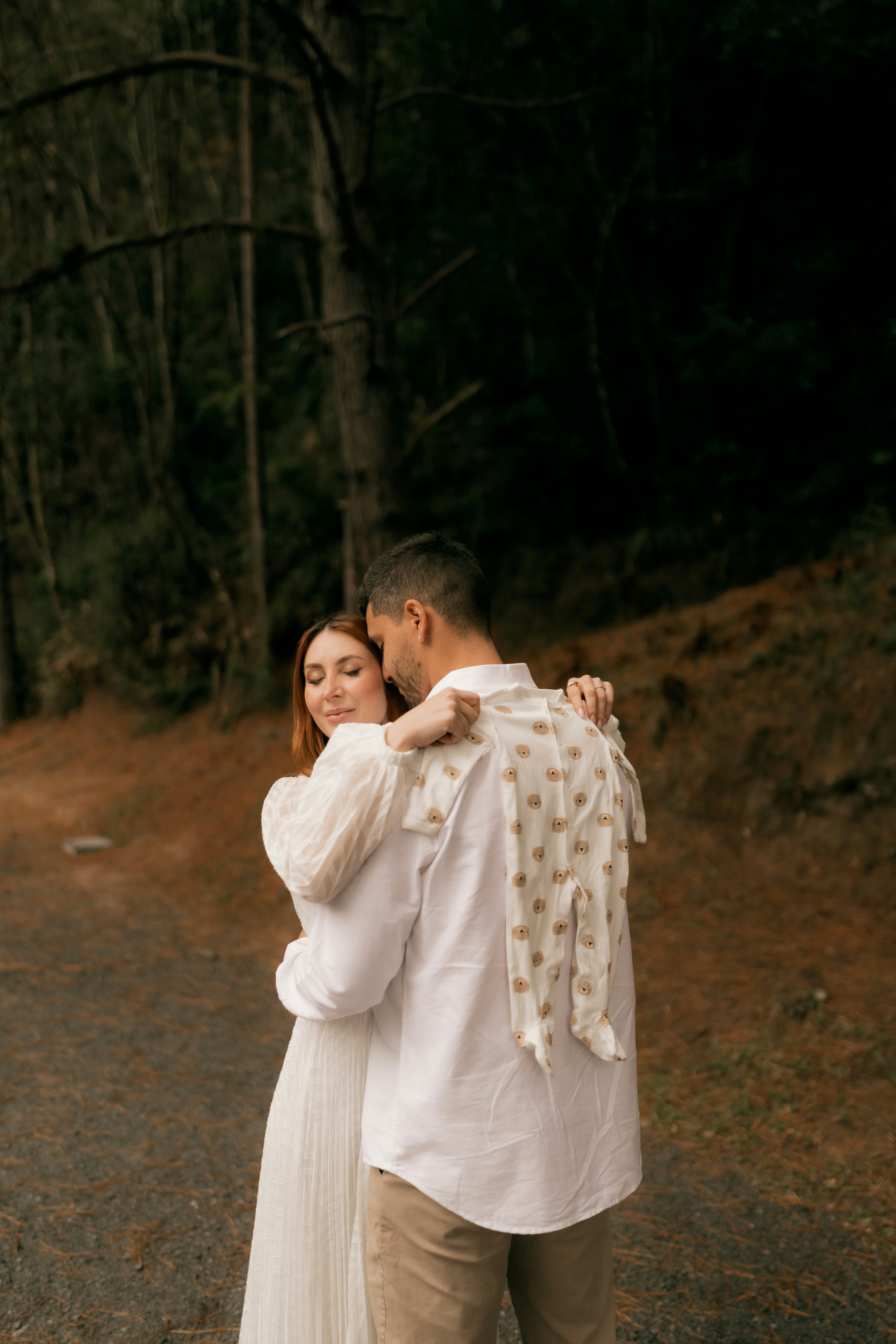 Embrace Under the Pines: A Quiet Moment Between Two