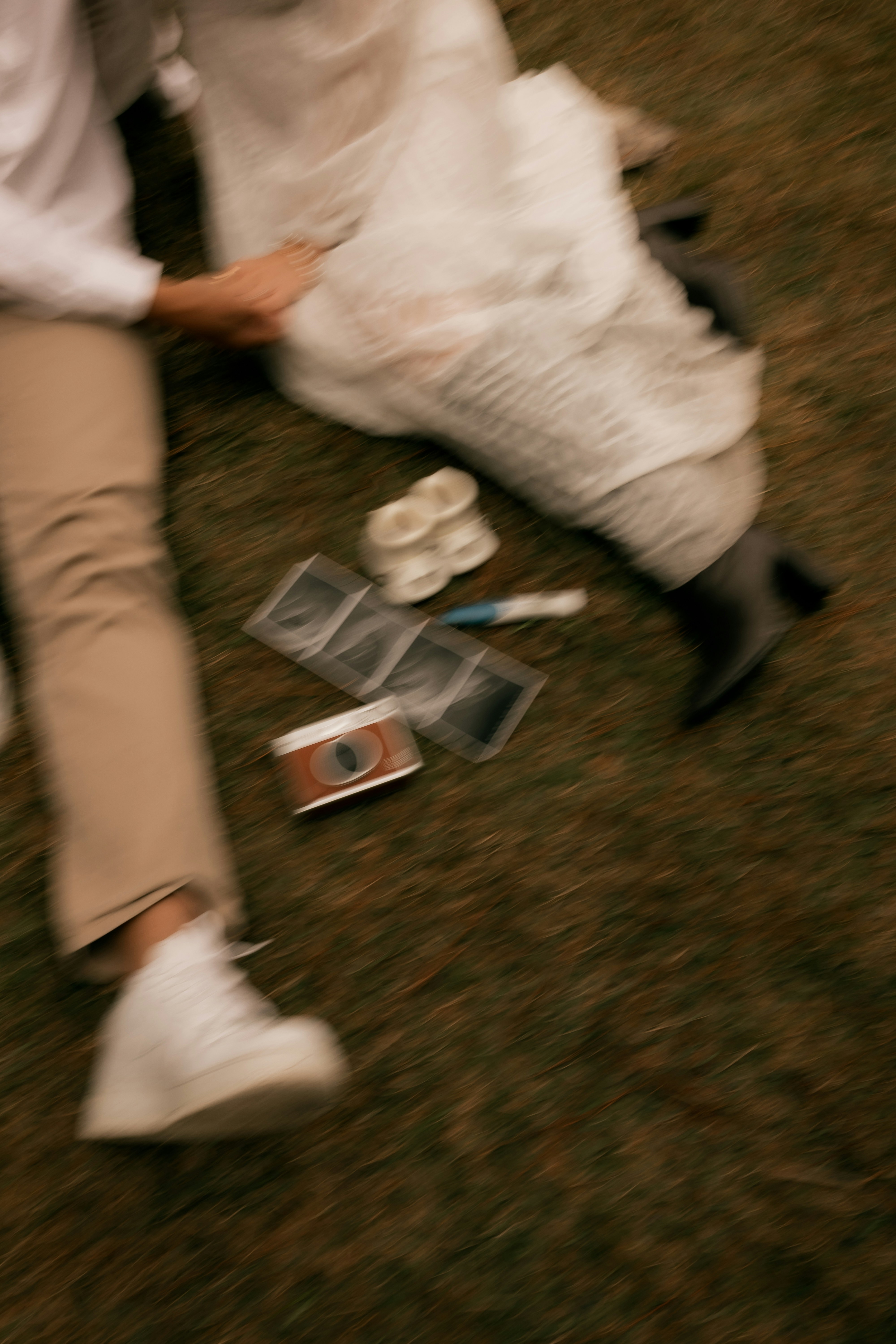 Blurred Sunset of a Casual Picnic: A Soft-Grain Moment on the Grass