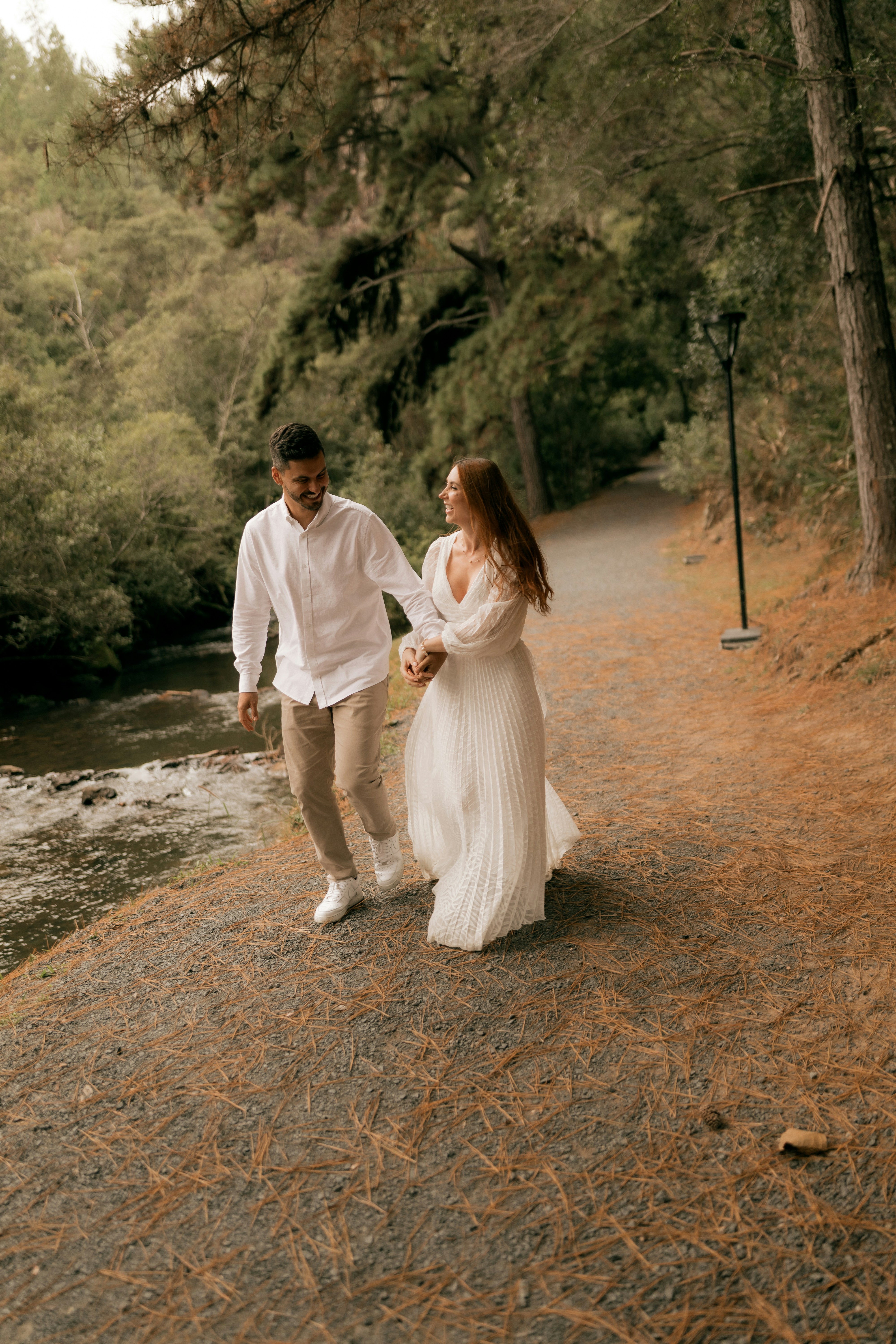 Walking Hand in Hand Through Autumn-dusted Trails