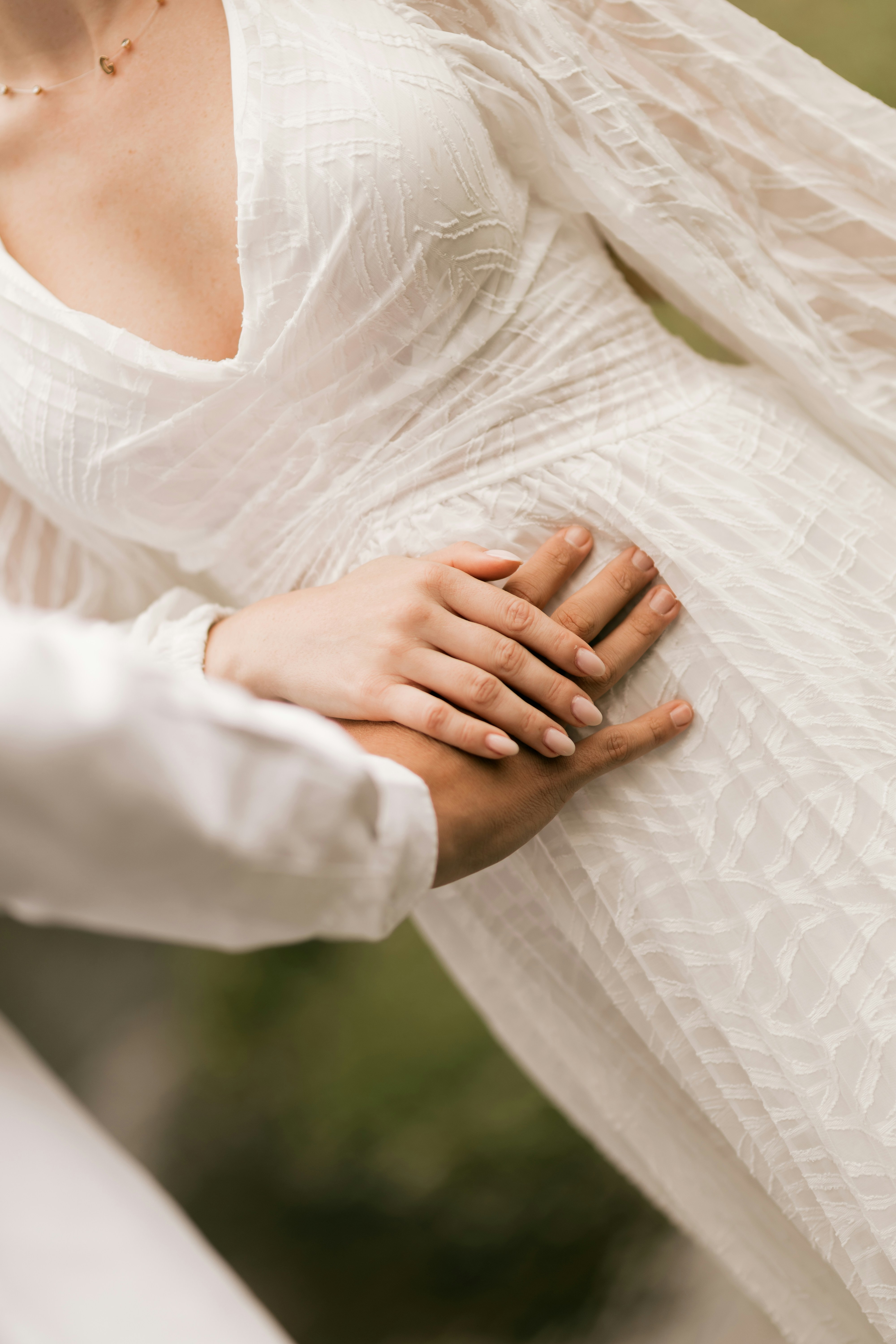 Embrace in White: A Quiet Moment of Expectant Calm