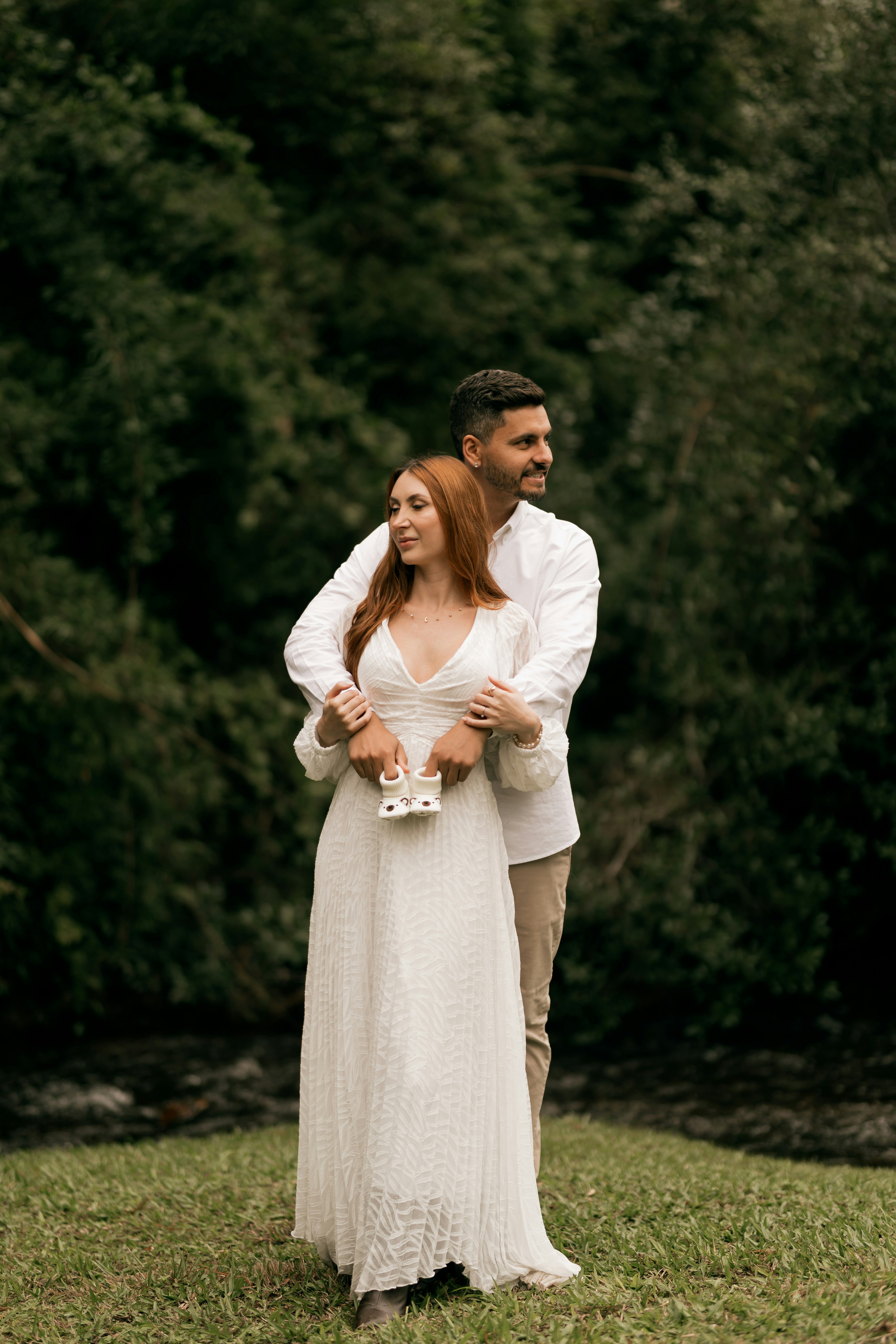 An Intimate Danse in the Meadow: Couple Embraced by Dusk