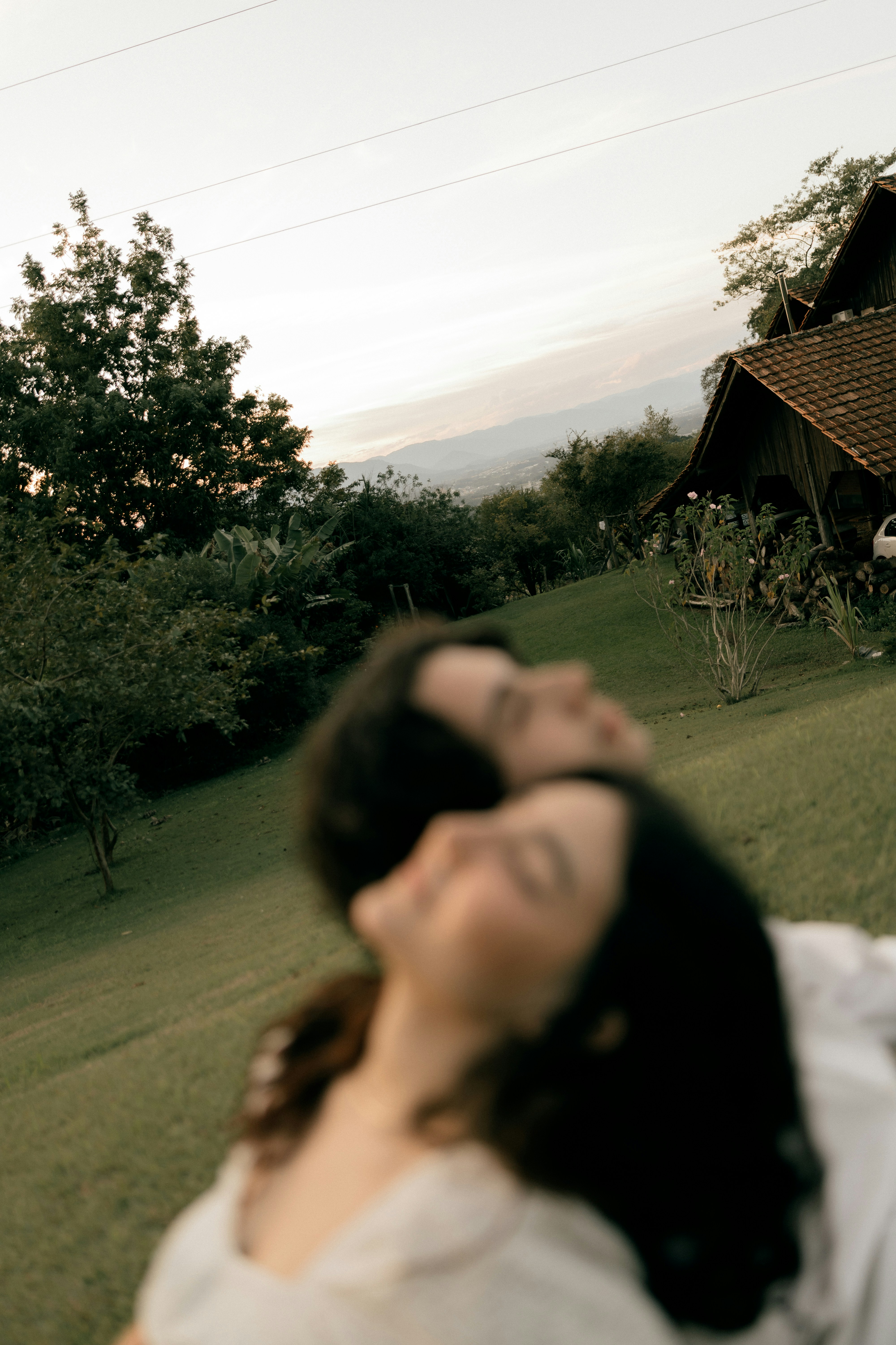 Blurred embrace under a hillside evening