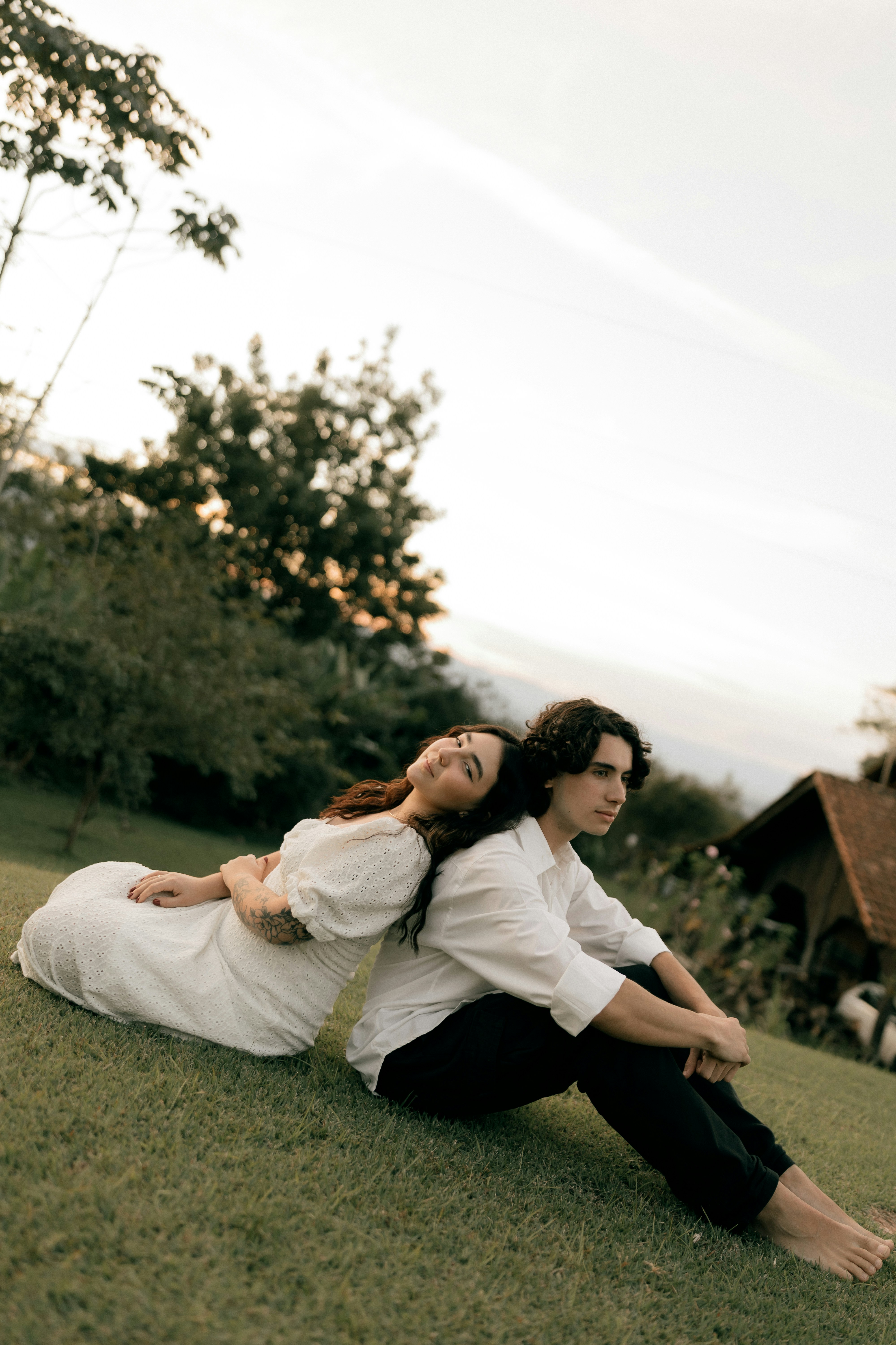 Quiet Couple on a Gentle Hill at Dusk