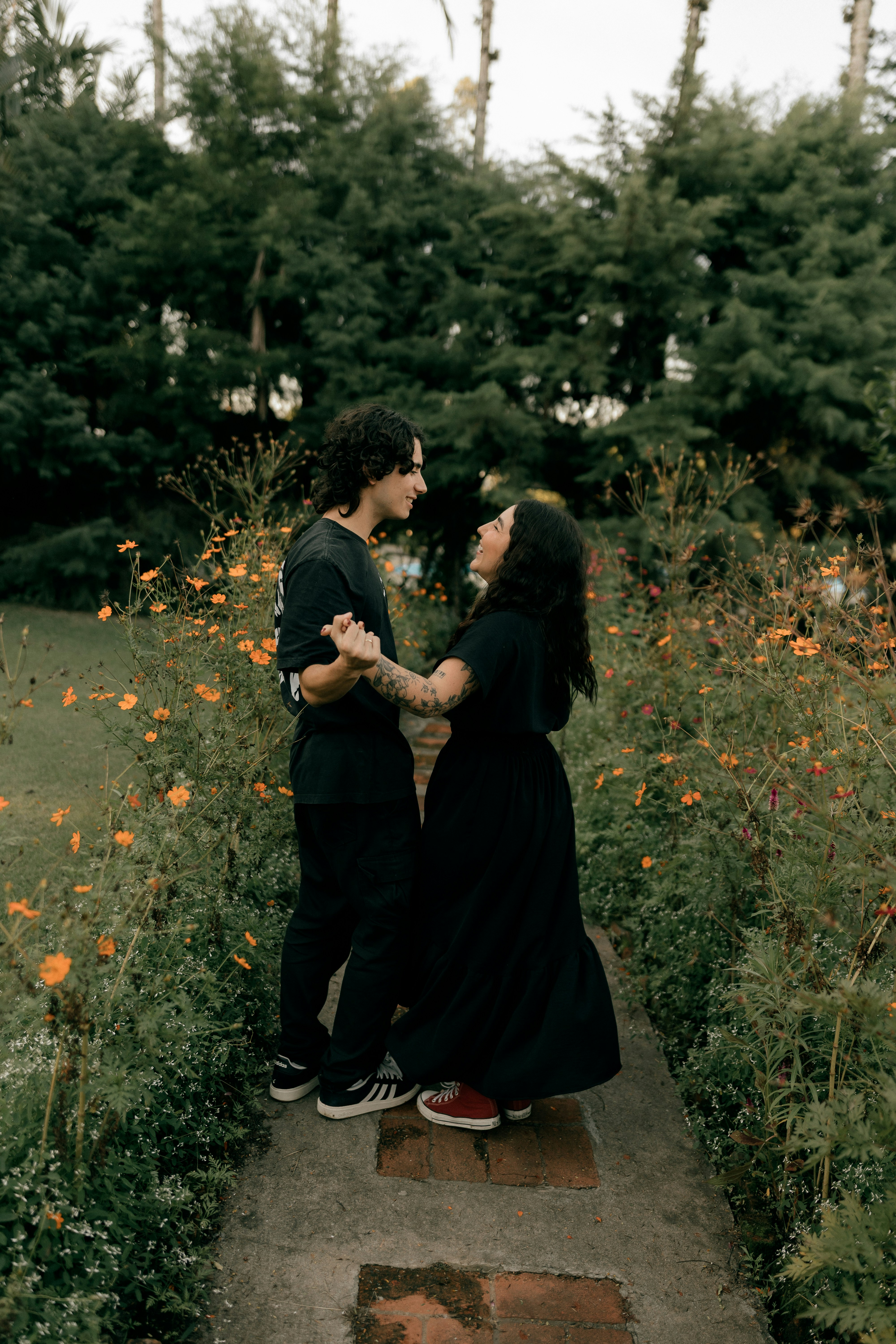 Shared Quiet Moment Amid a Meadow of Orange Blooms