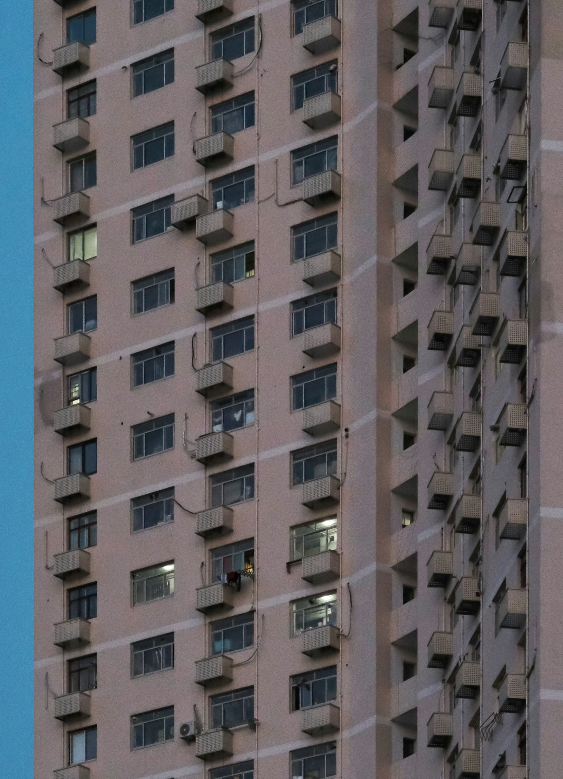 Balconies in a Dusk Facade: An Urban Tower's Quiet Rhythm