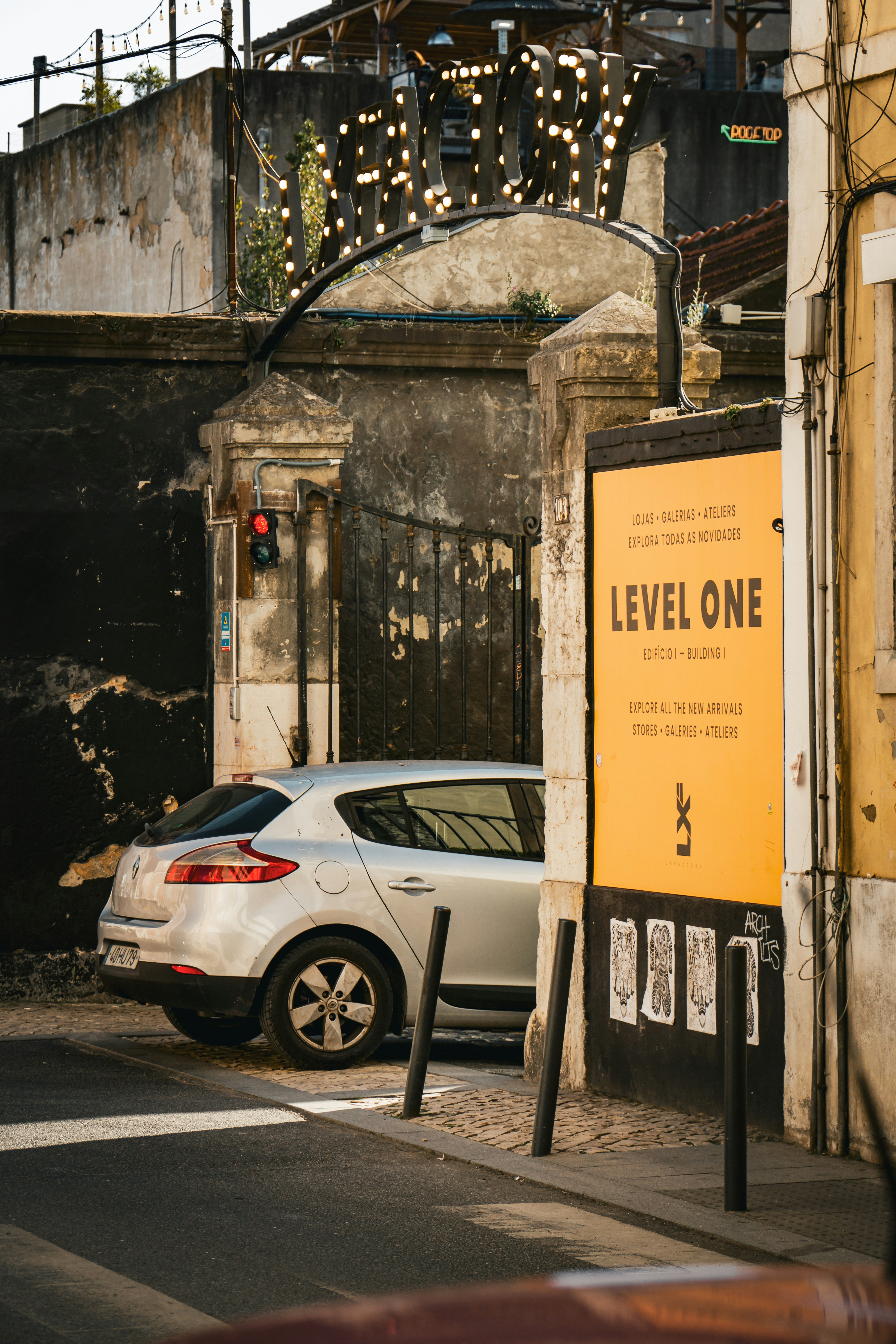 LX Factory Entrance: The illuminated entrance of LX Factory marks one of Lisbon’s most vibrant creative hubs, where art, culture, and industry converge.