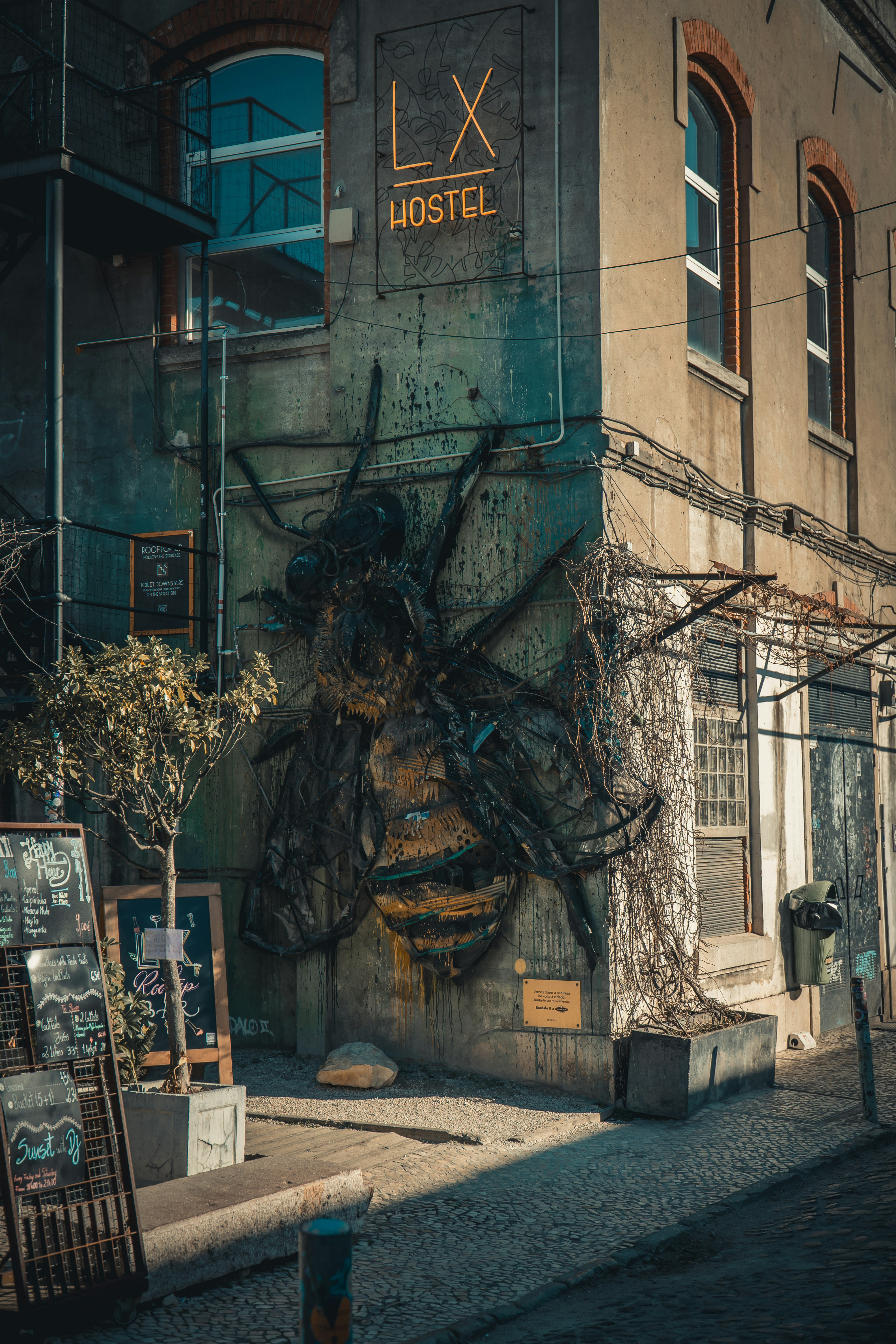 Urban Facade: The Giant Mangrove-Like Sculpture Clinging to a City Wall