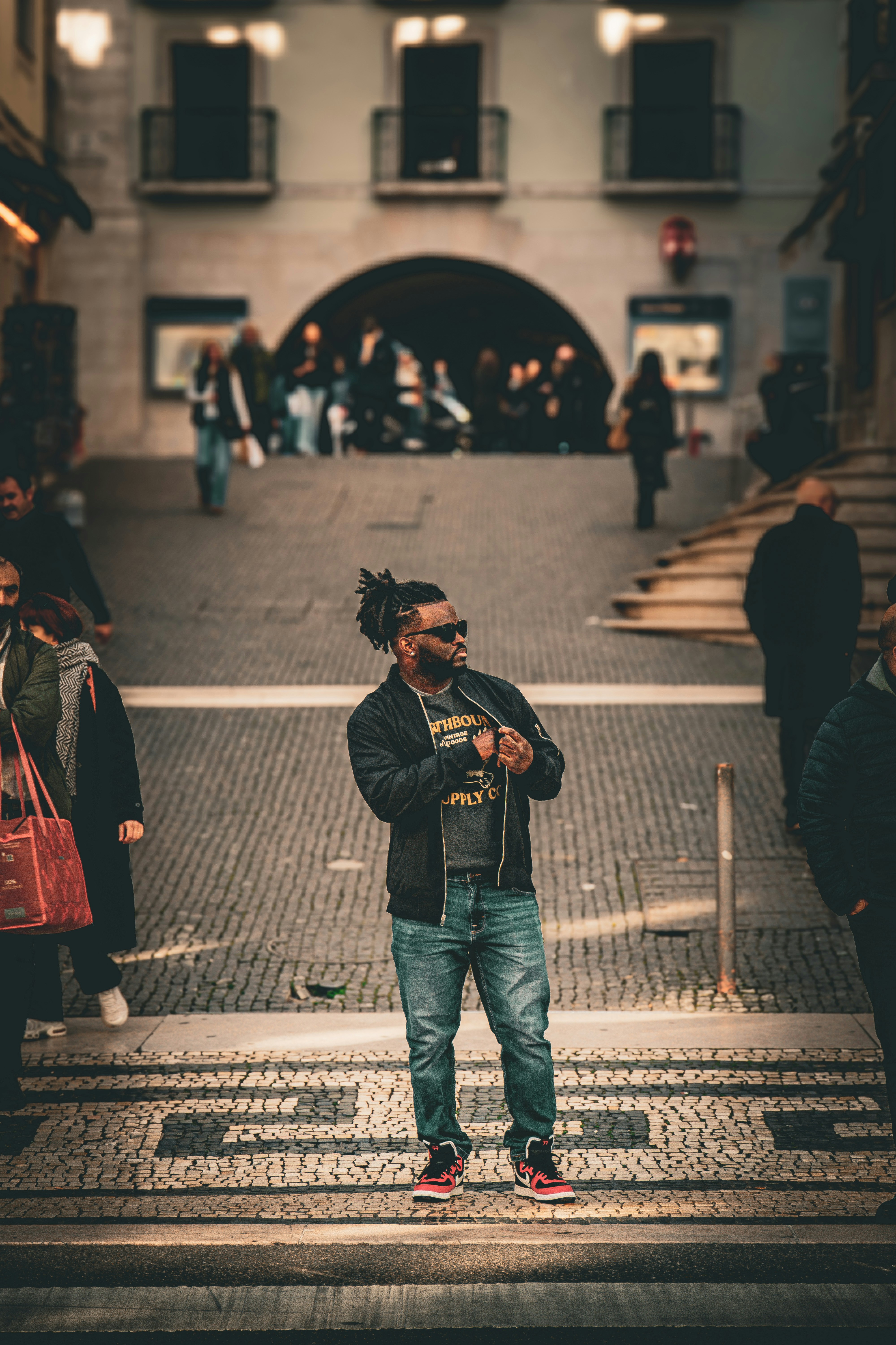 Street Style Serenade: Man with Dreads in the City Square