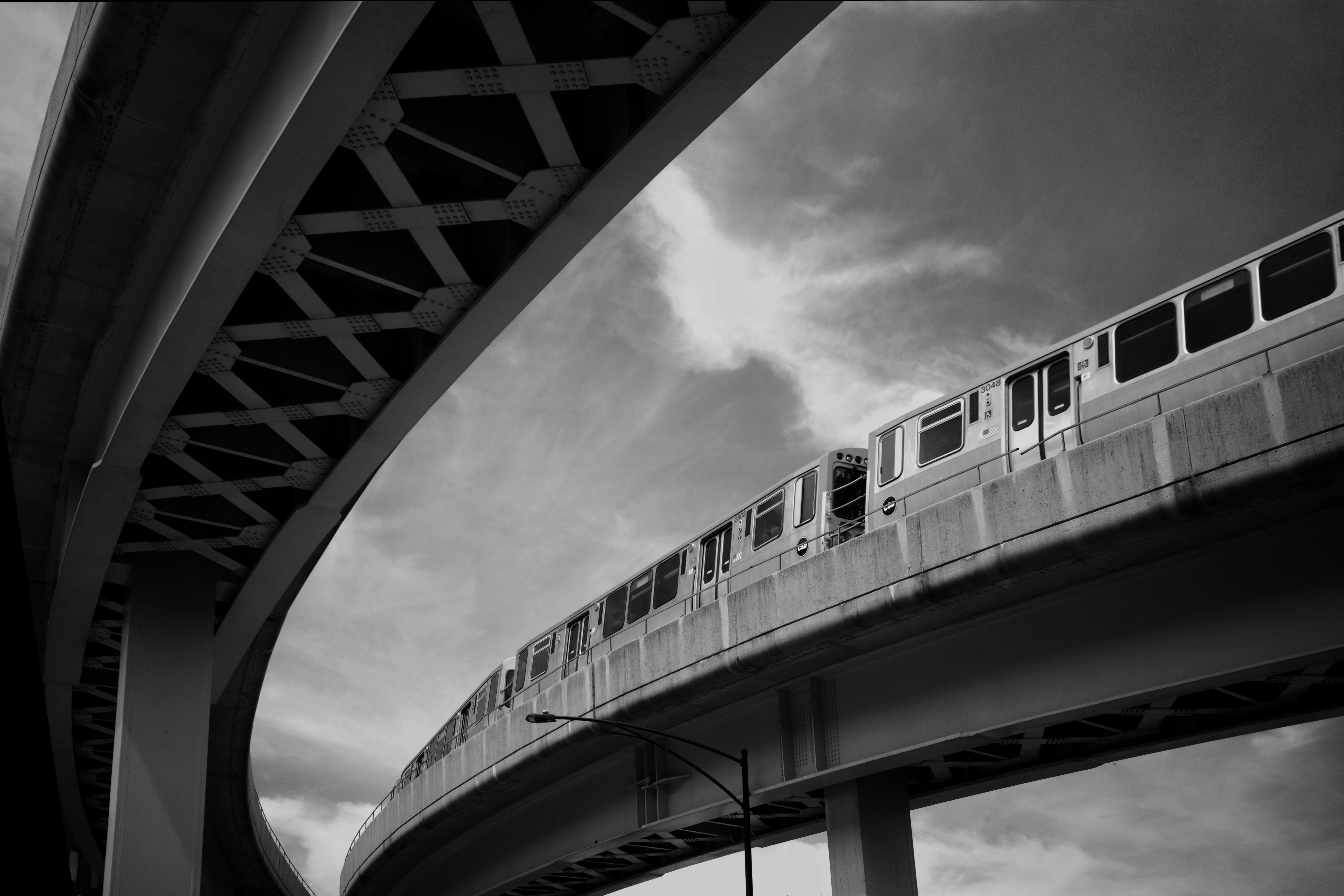 Crossing Rails Above the City: A Monochrome Transit Arc