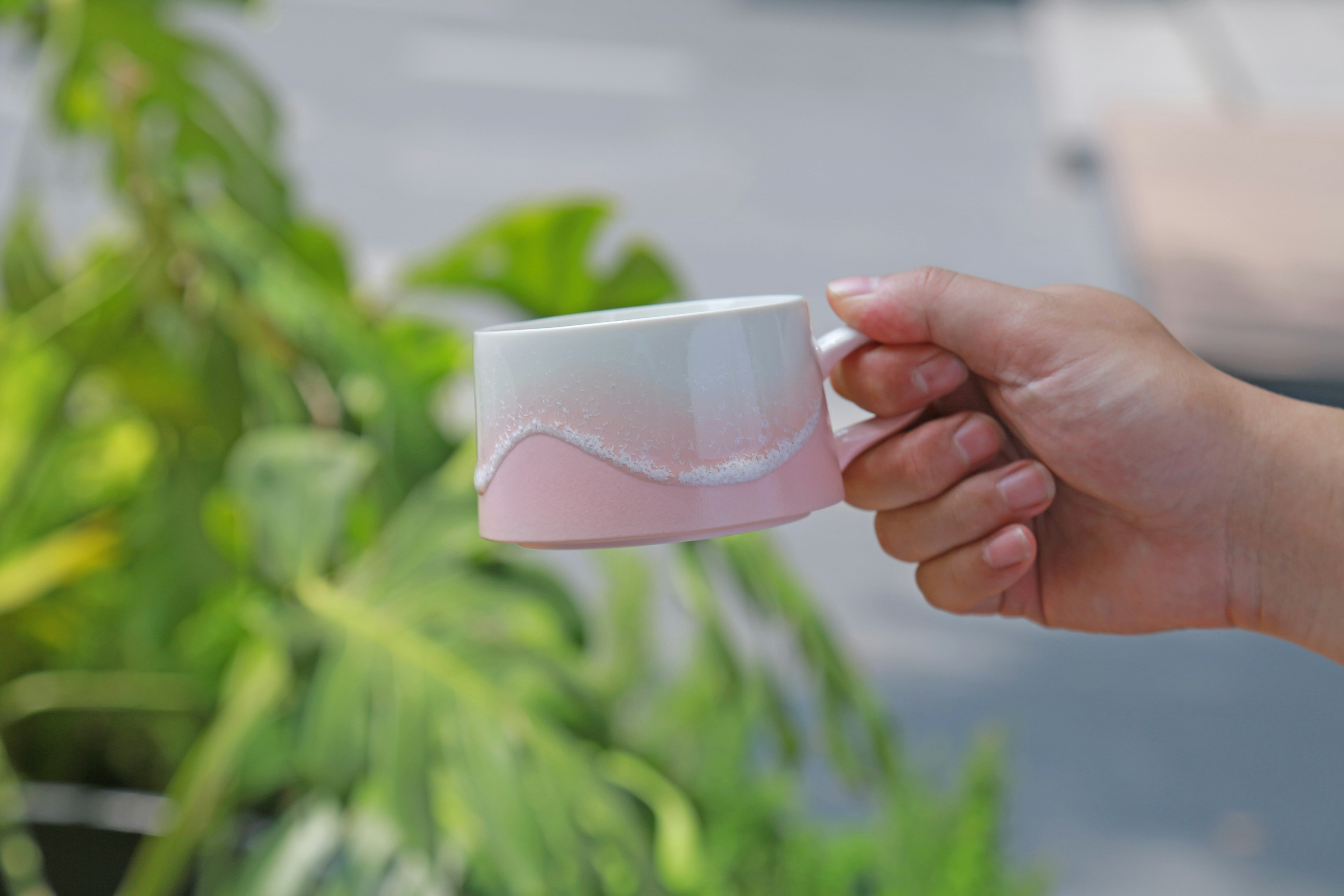 Warm Teacup Glow: A Gentle Hand Passes Tea in Soft Afternoon Light