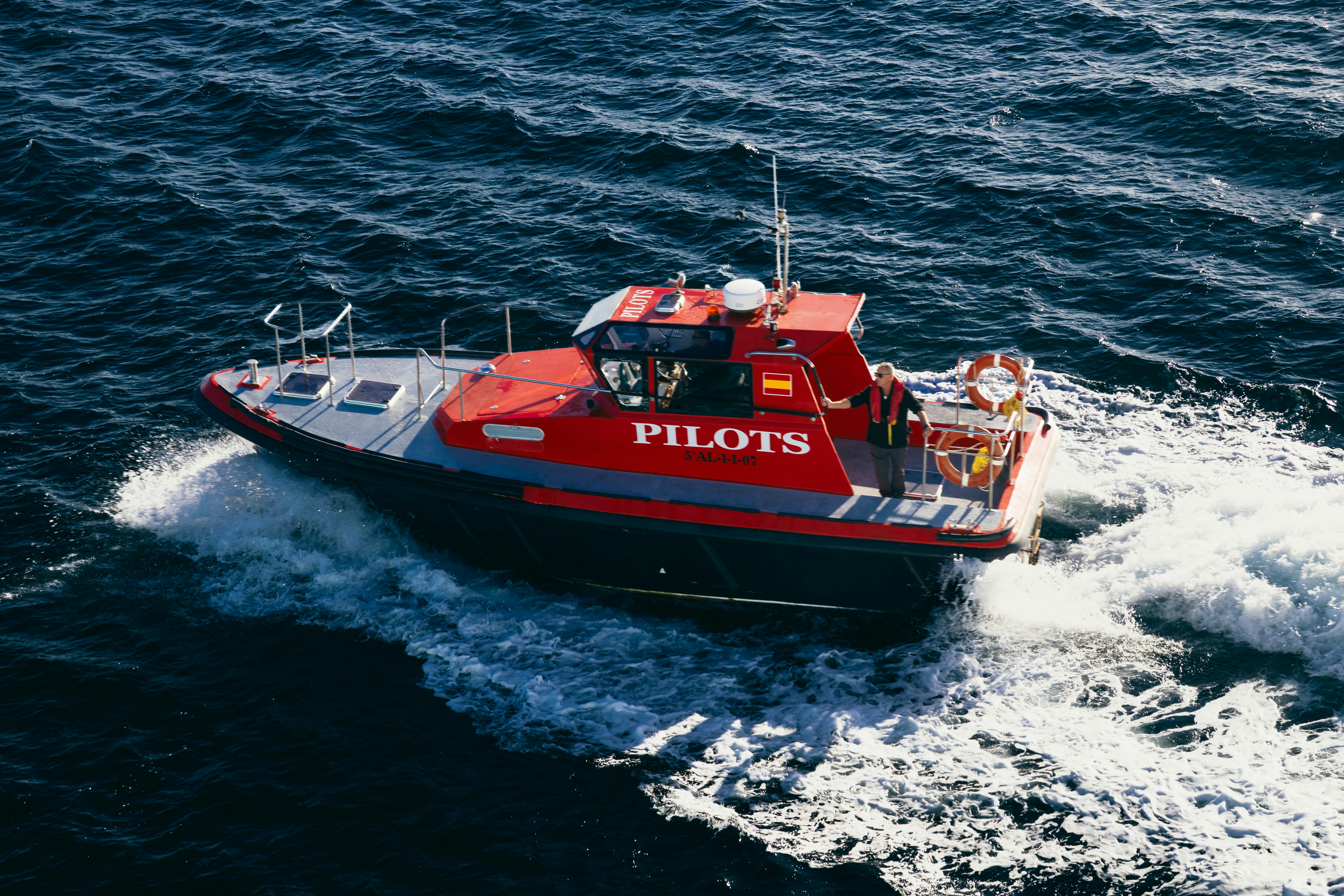 Red Pilot Boat Cutting Through Atlantic Blues