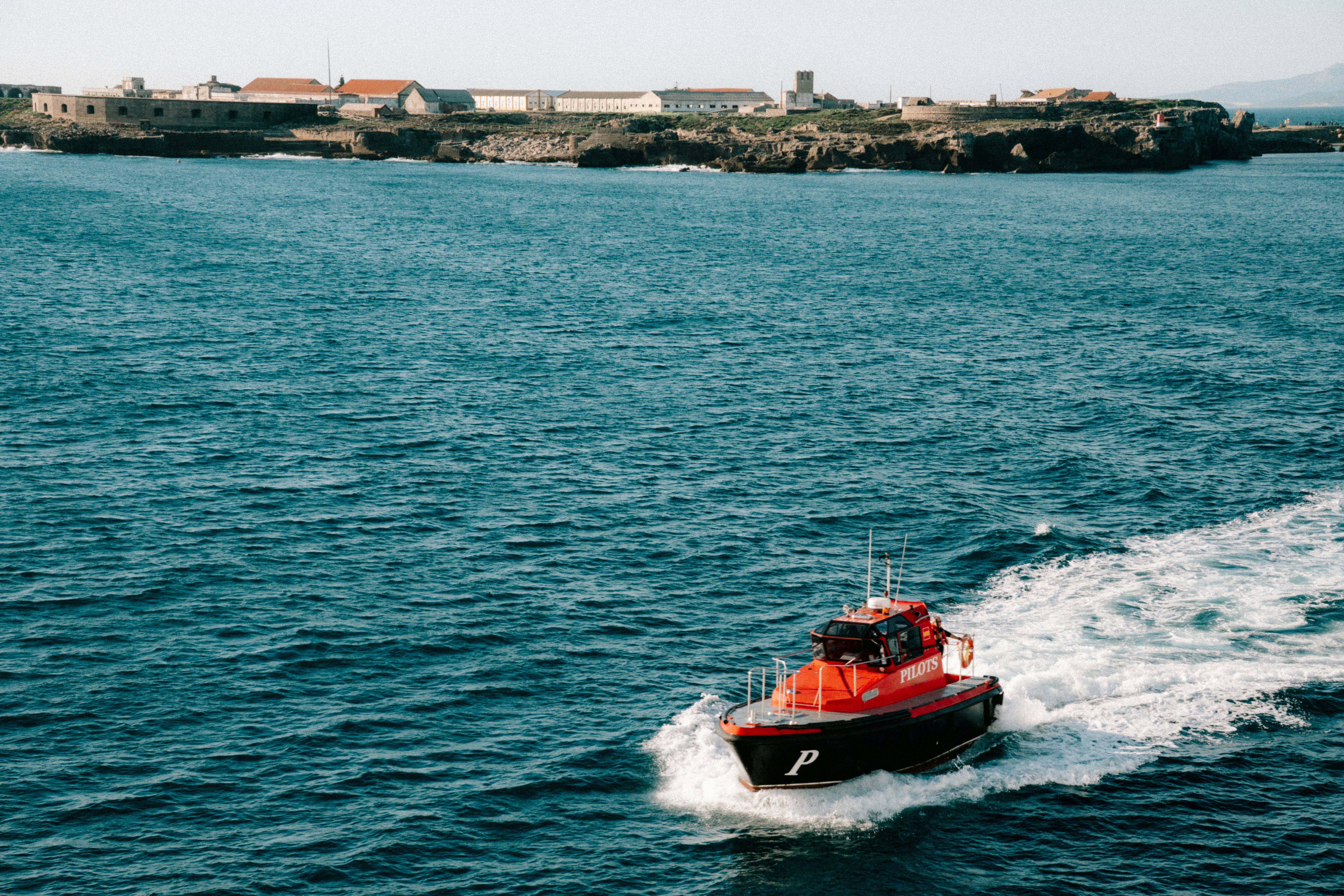Red Tender Breaking Through Blue Atlantic