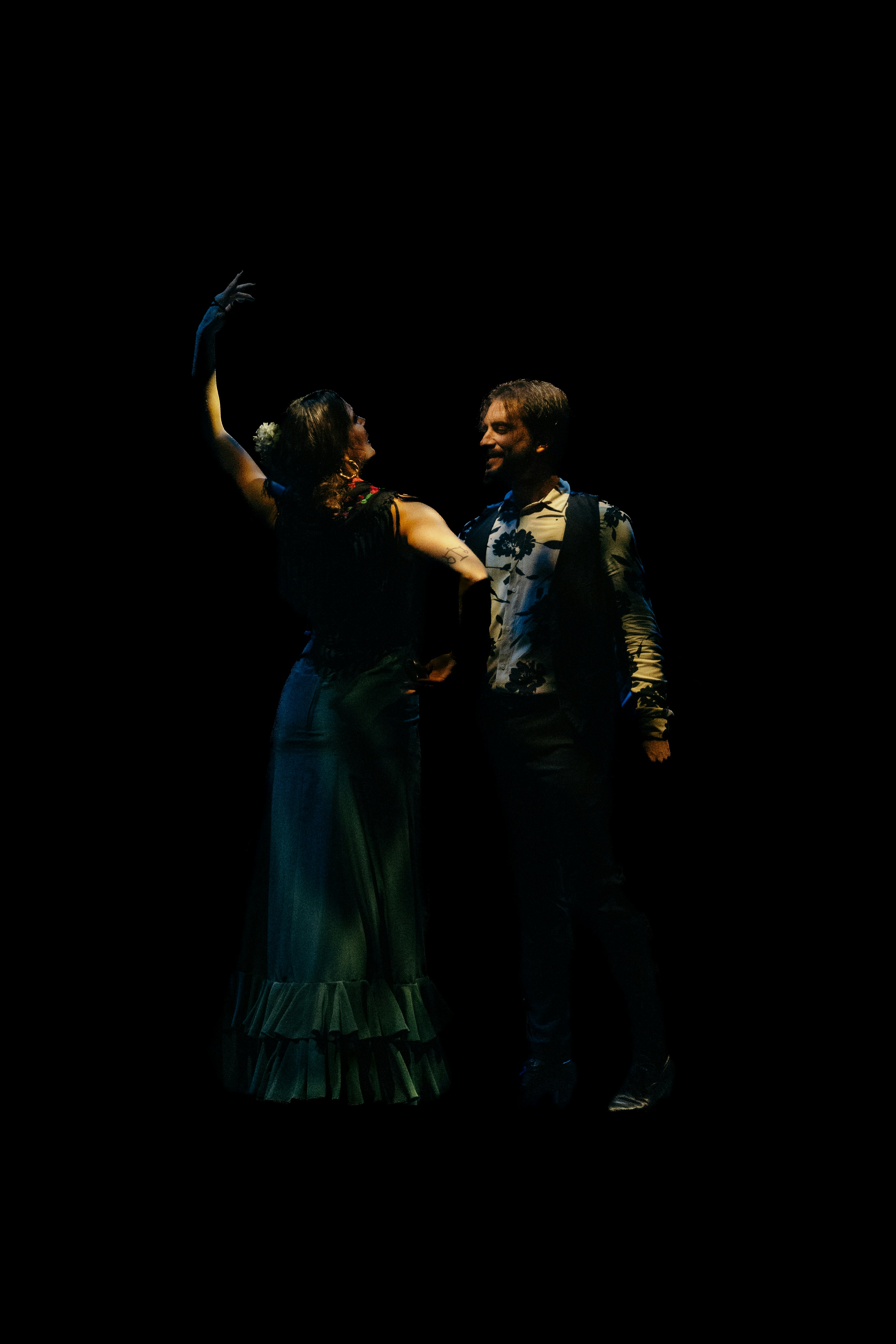Midnight Tango: Two Figures Beneath a Shout of Spotlight