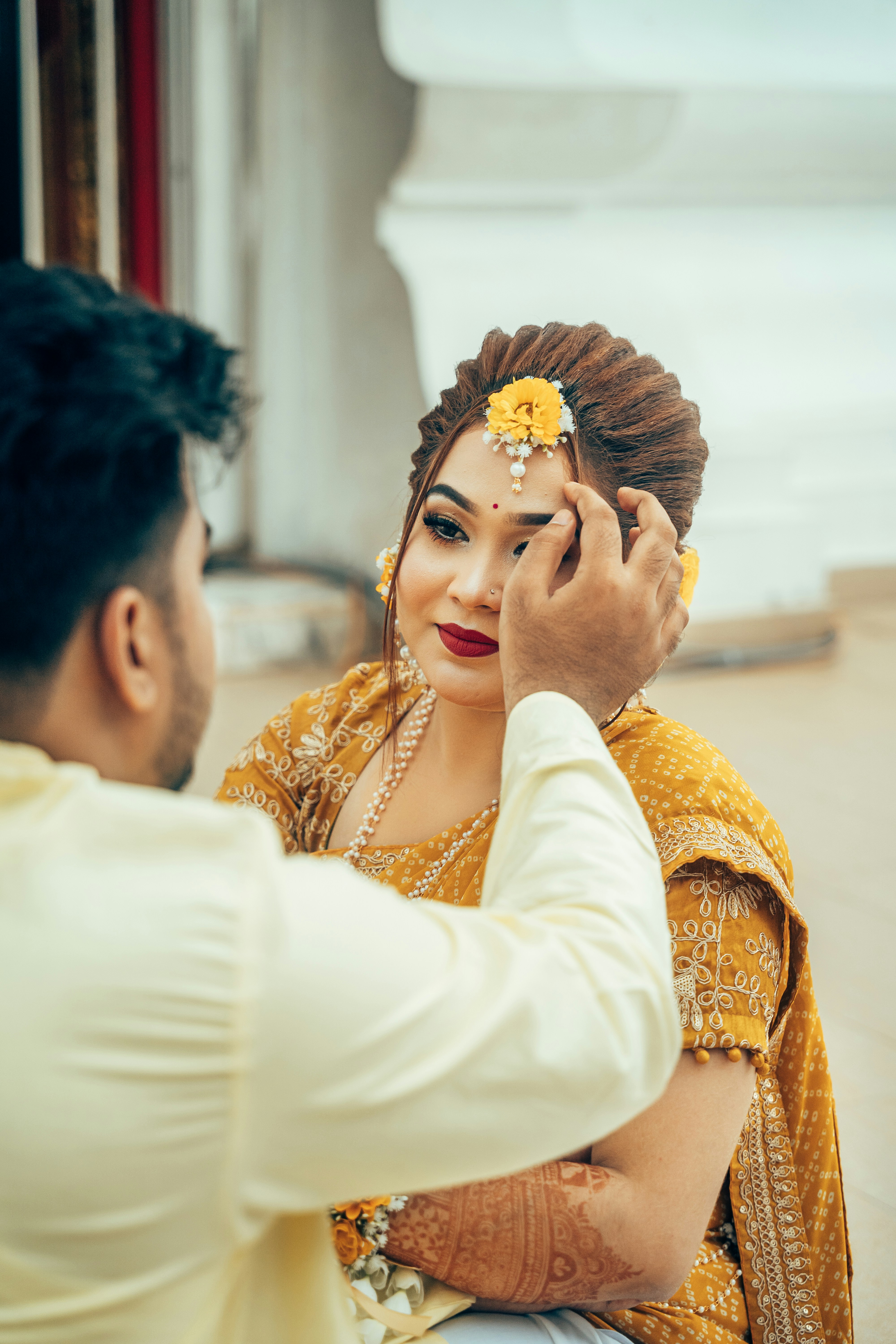Bride and Groom in a Golden Moment: Arranged Elegance