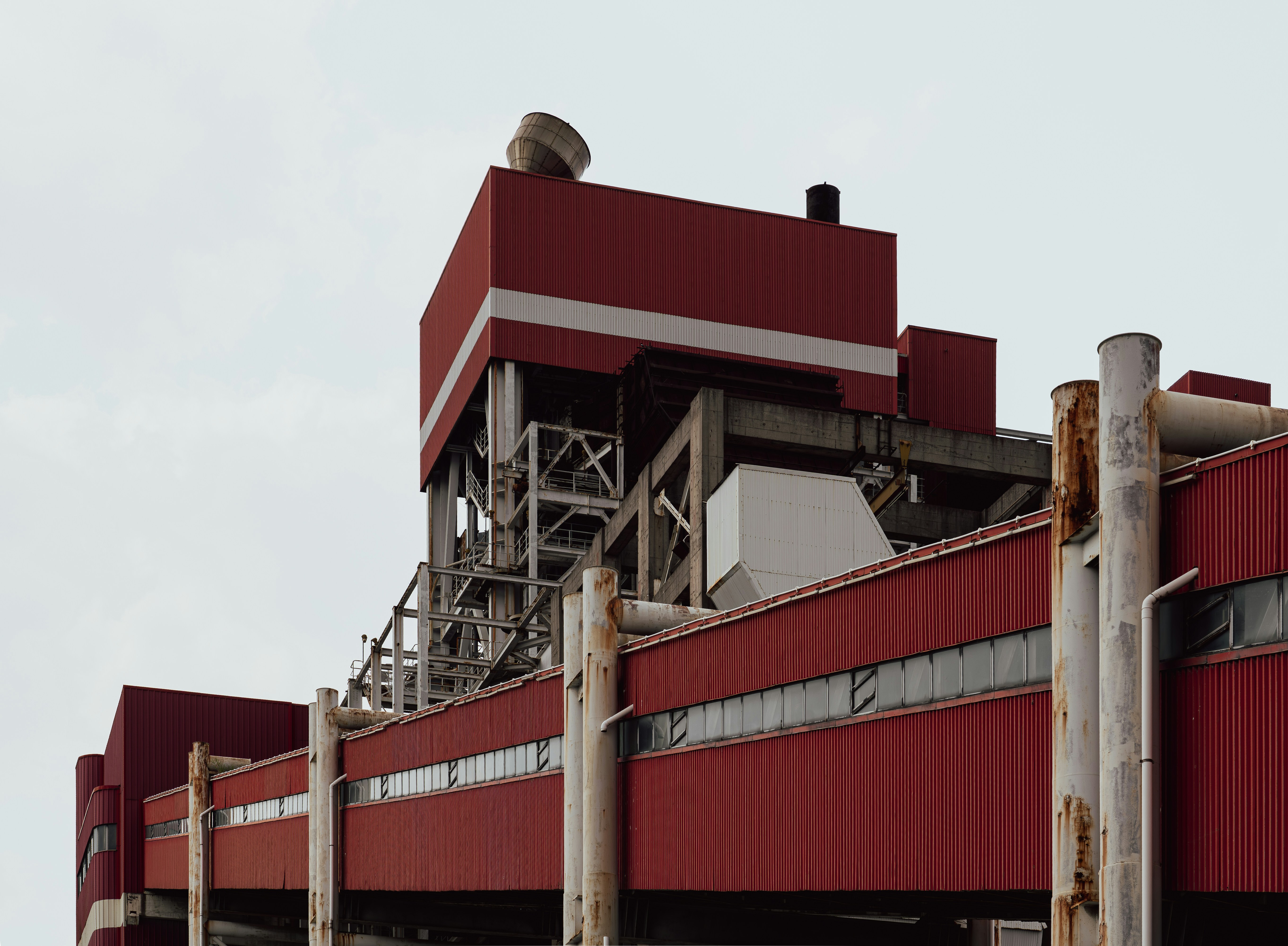 Red Industrial Crossbeam: Concrete Elevation and Rust
