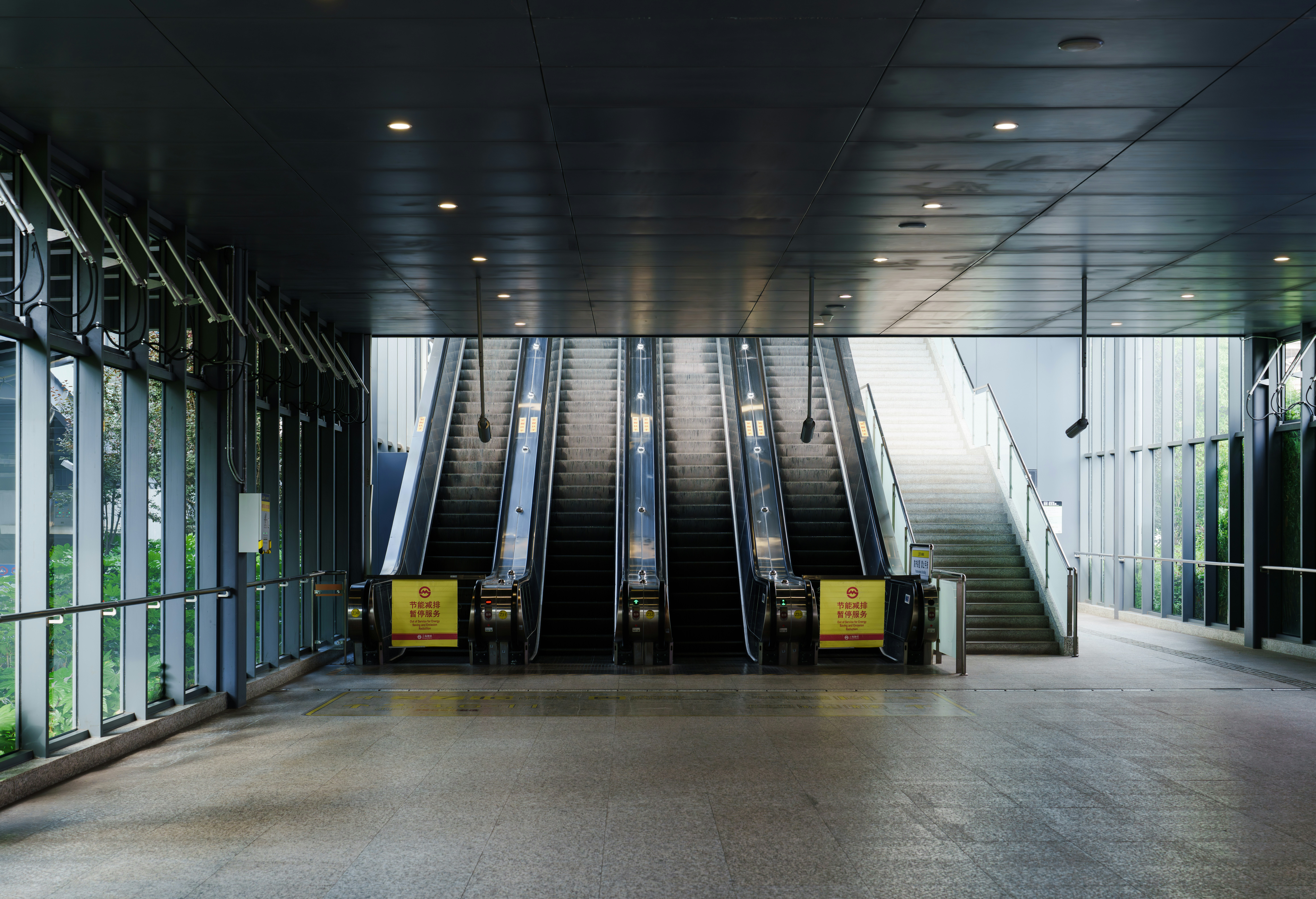 Quiet Terminal: Escalators Standing Still in an Empty Corridor